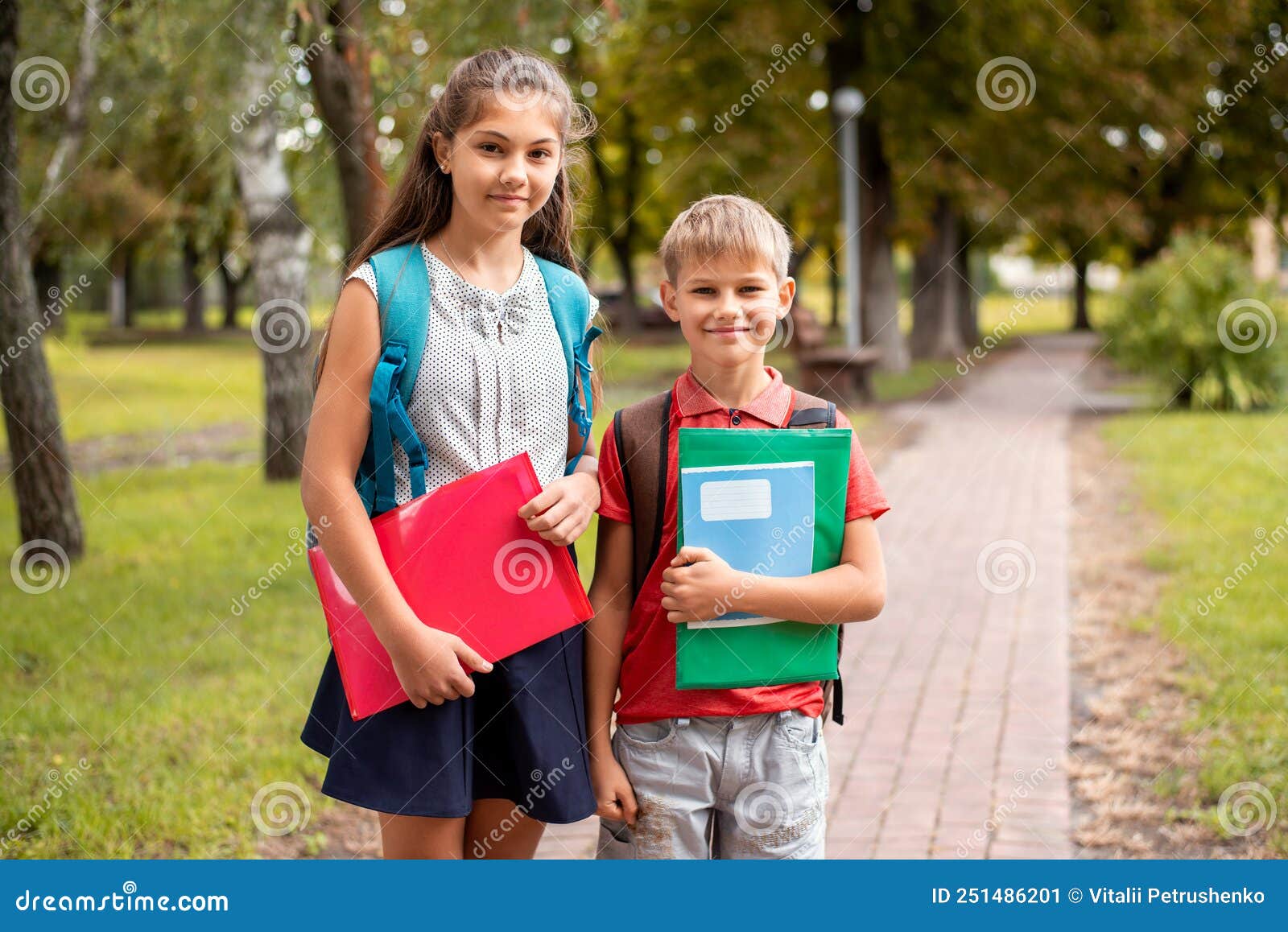 Two School Learners Standing with Learning Materials Stock Image ...