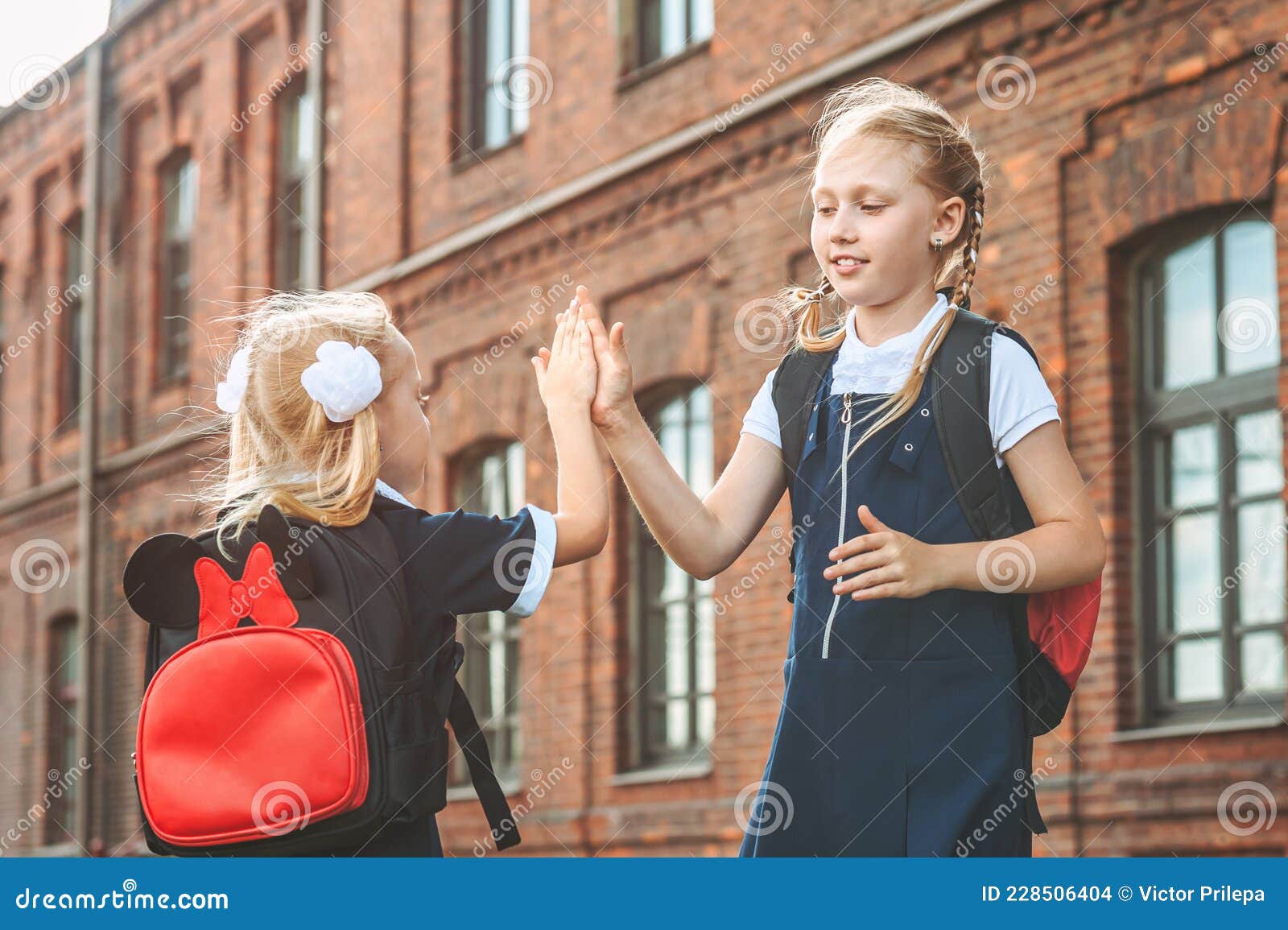 Two Schoolgirls Give Each Other Five. First Day of Study. Concept on ...