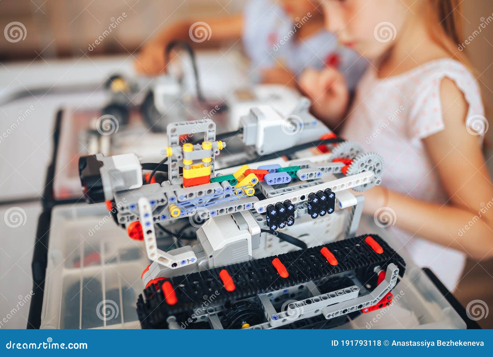 Robot Constructor. Defocus Little Boy Made Robots On Table. Train An ...