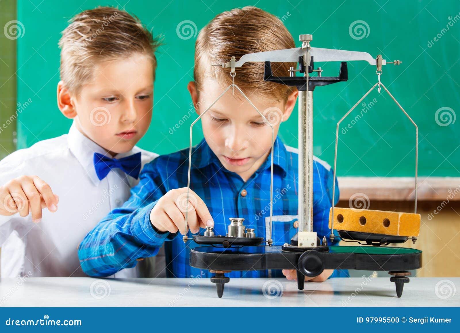 Two Schoolmates Use Scales on Lesson in School Stock Photo - Image of ...
