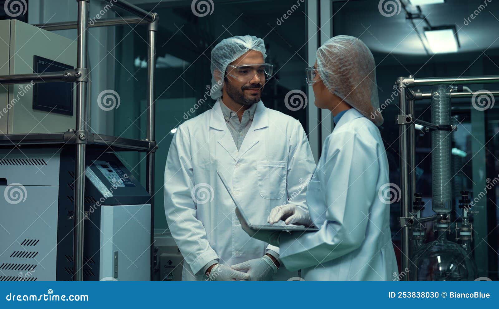 Two Scientist in Professional Uniform Working in Laboratory Stock Photo ...