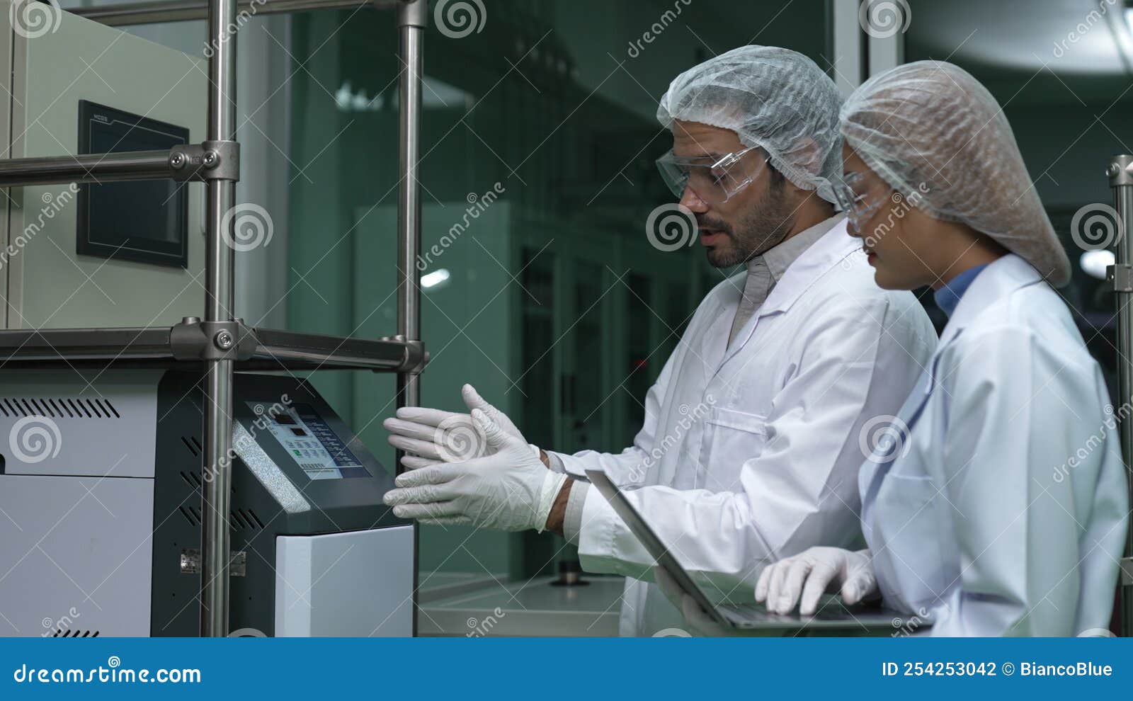 Two Scientist in Professional Uniform Working in Laboratory Stock Photo ...