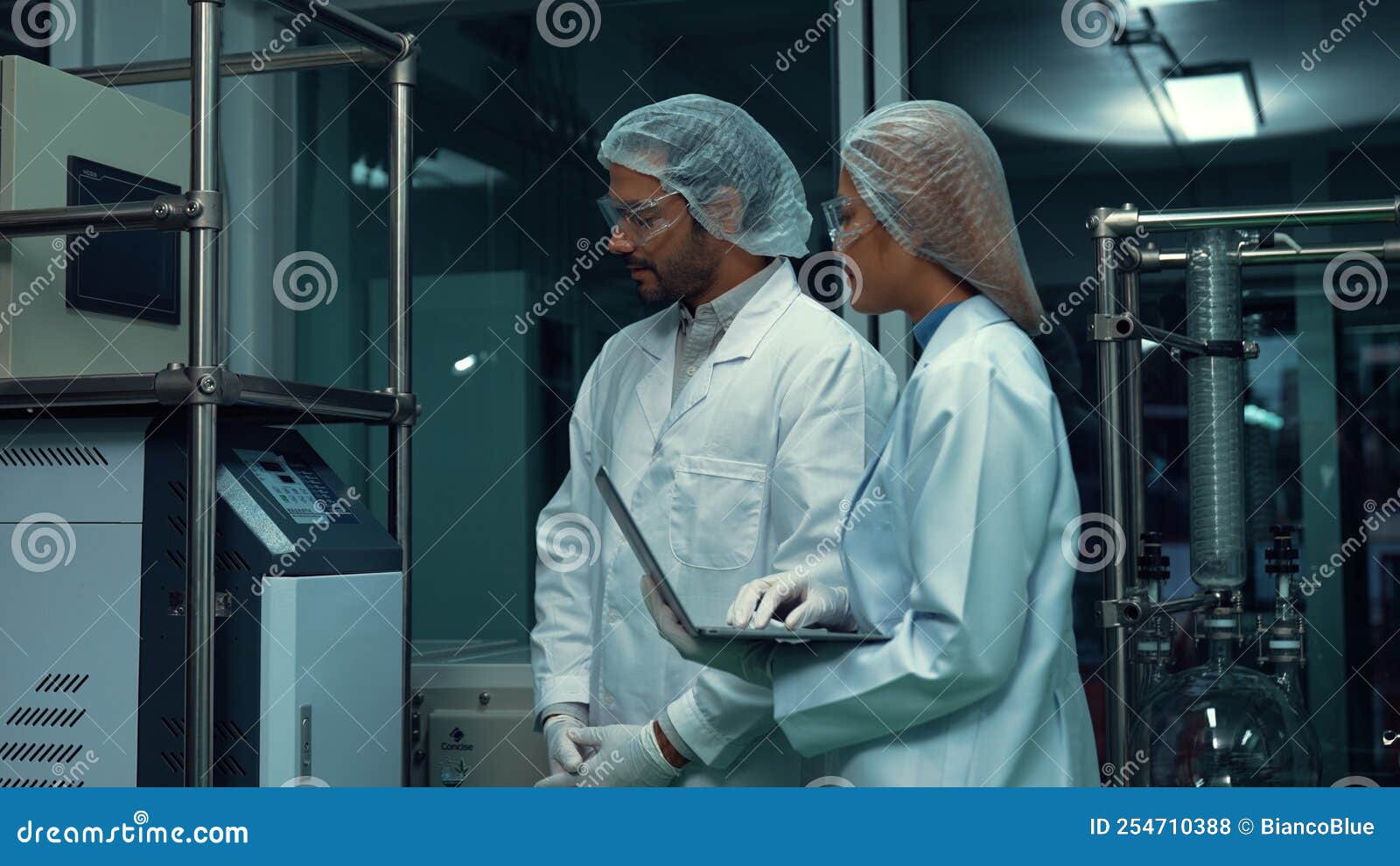 Two Scientist in Professional Uniform Working in Laboratory Stock Photo ...