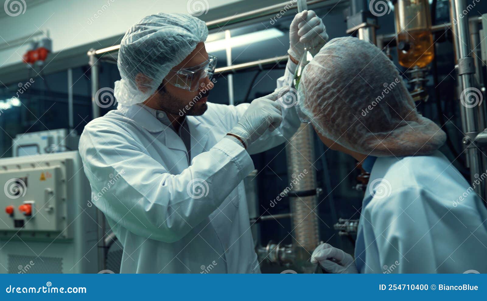 Two Scientist in Professional Uniform Working in Laboratory Stock Photo ...