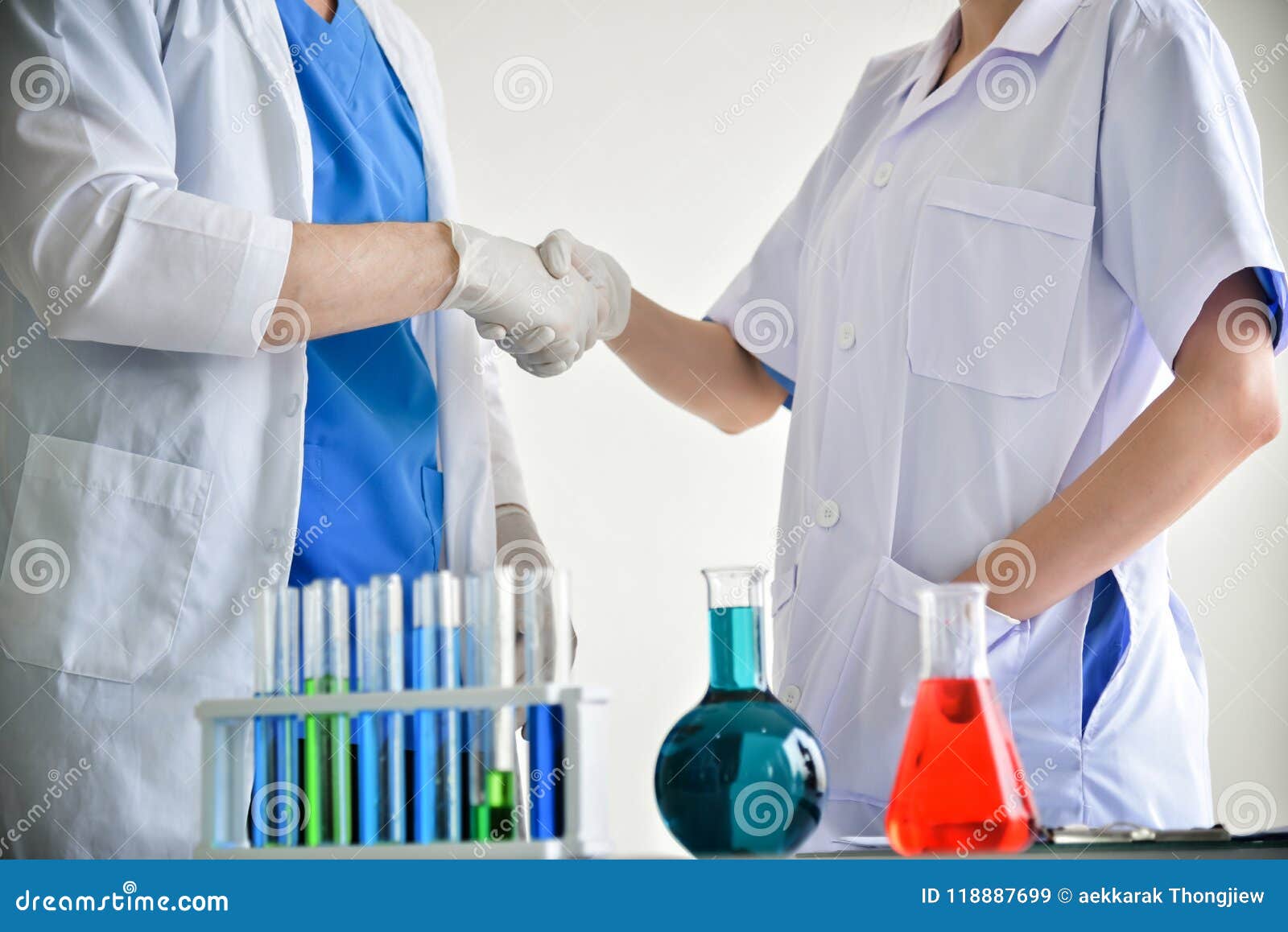 Two Scientists are Handshaking. Stock Image - Image of analysis, blue ...