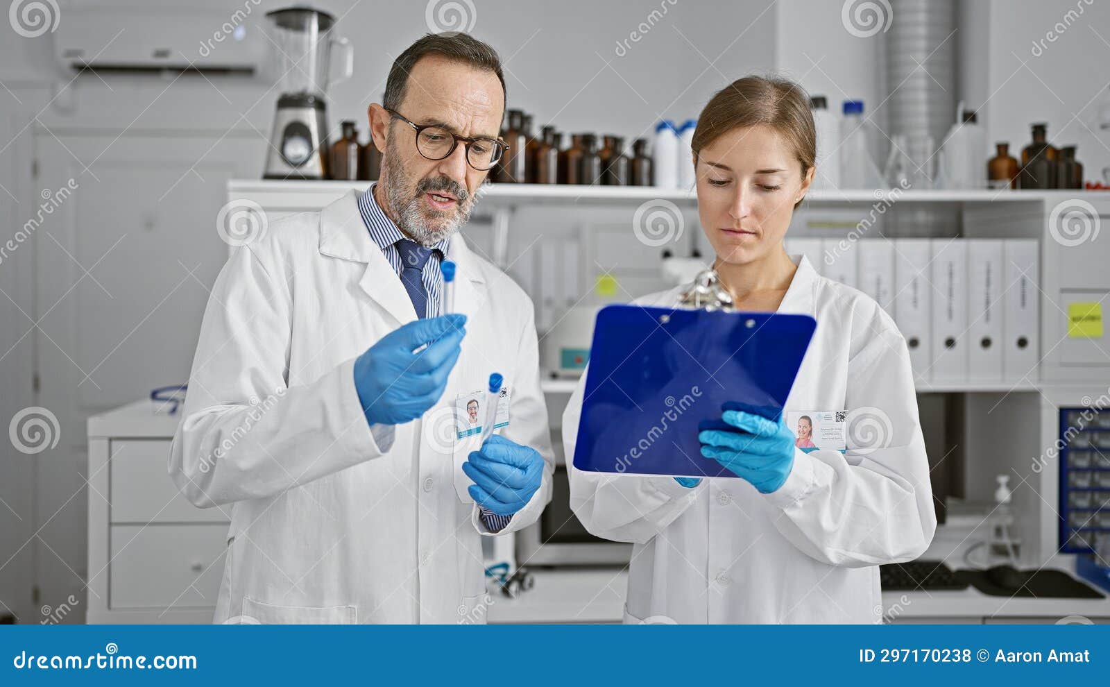 Two Scientists Holding Test Tube Taking Notes at Laboratory Stock Photo ...