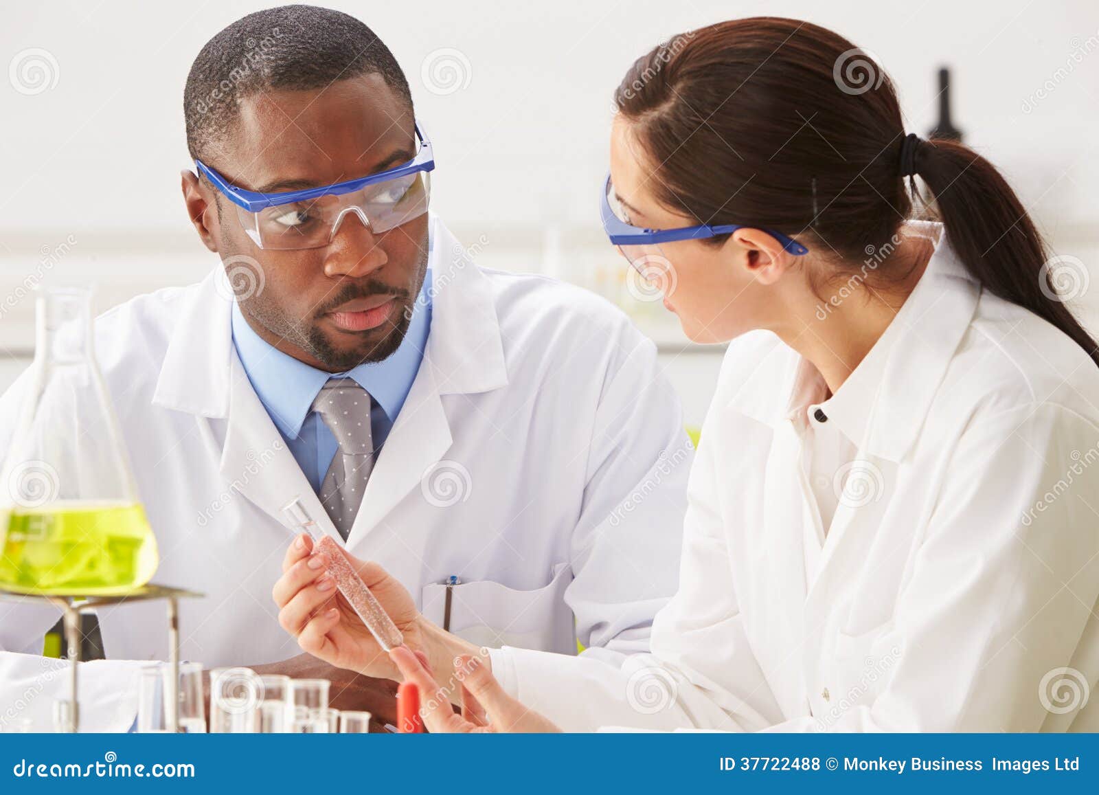 Two Scientists Performing Experiment in Laboratory Stock Photo - Image ...