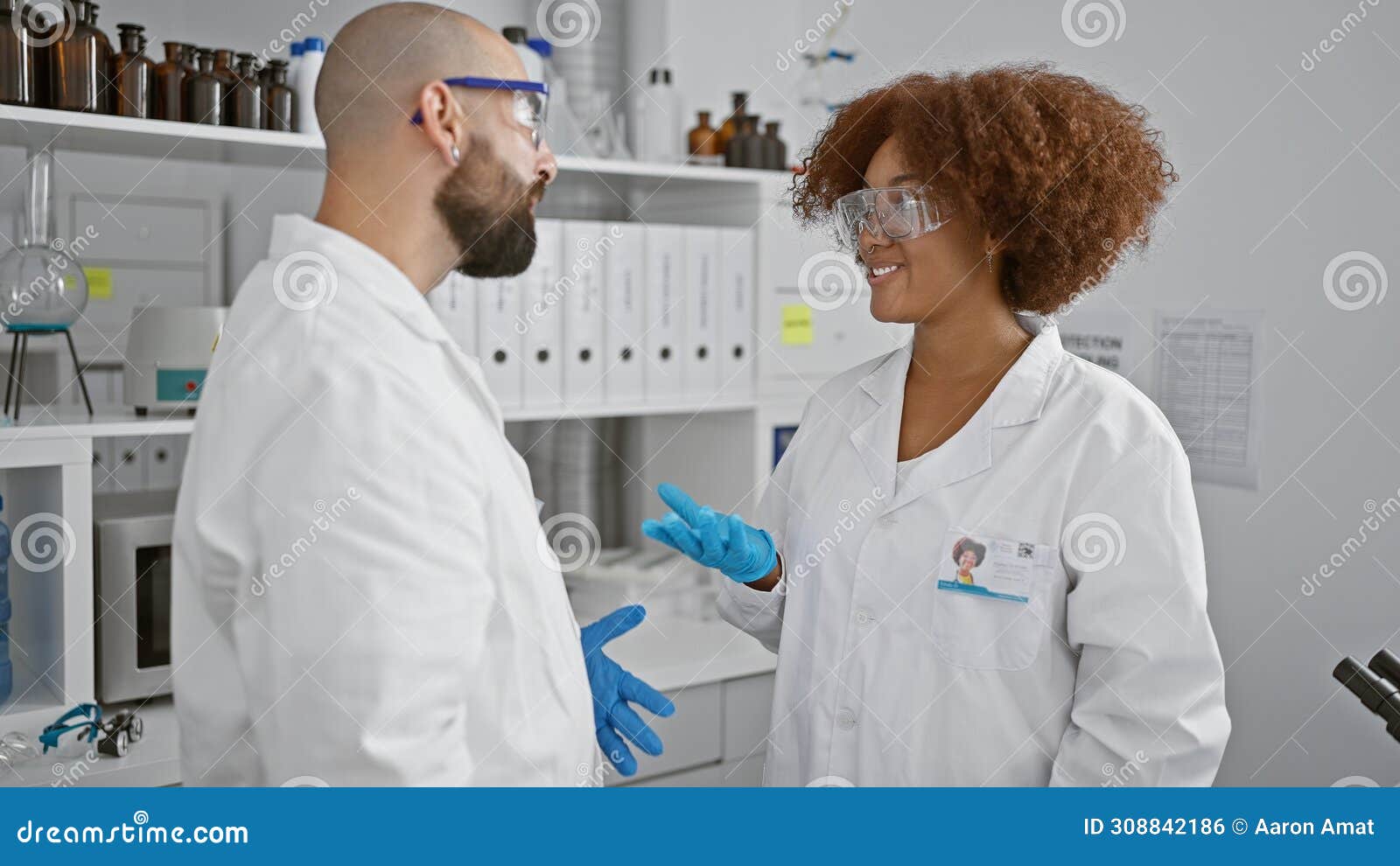 Two Scientists Standing Together Speaking at Laboratory Stock Photo ...