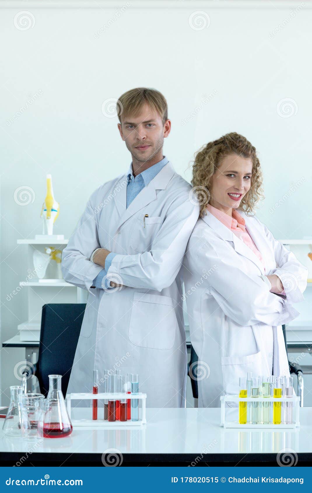 Two Scientists Stood Confidently with Folded Arms before the Experiment ...