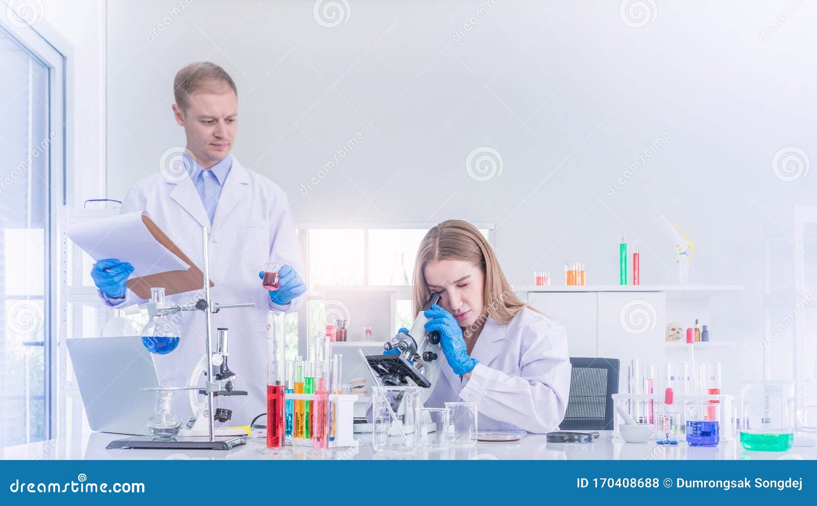 Two Scientists Working in Chemical Laboratory Stock Photo - Image of ...