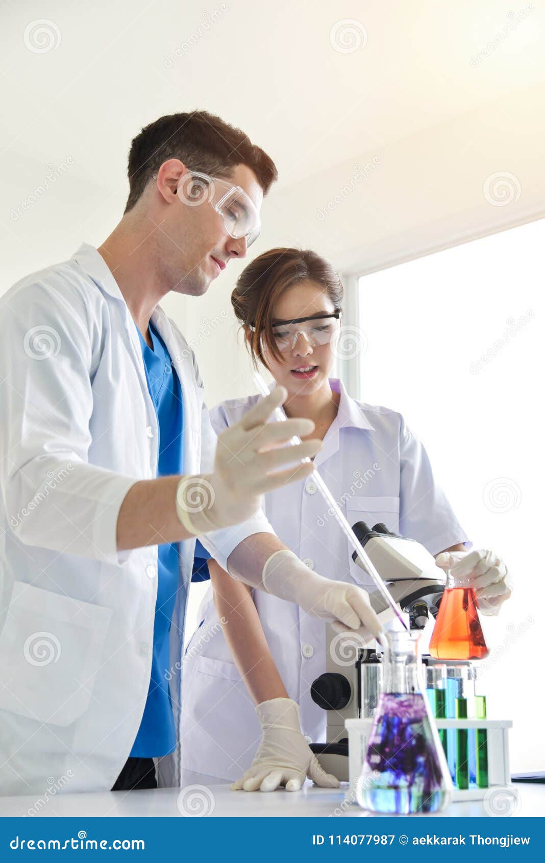 Two Scientists are Working in Laboratory. Stock Image - Image of ... Two Scientists are Working in Laboratory. Stock Image - Image of ...