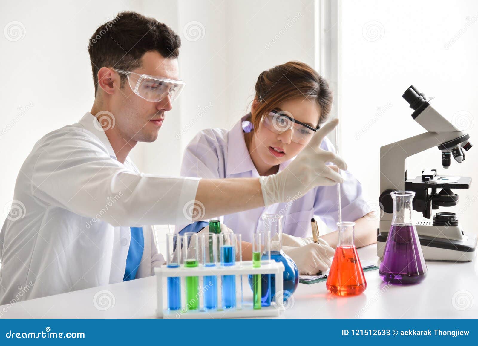 Two Scientists are Working in Laboratory. Stock Image - Image of ... Two Scientists are Working in Laboratory. Stock Image - Image of ...