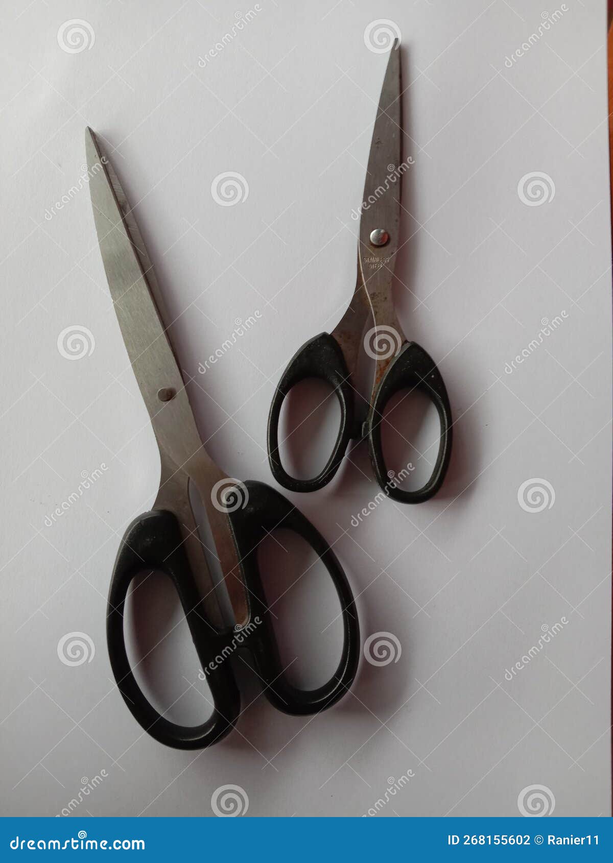 Two Scissors with Different Size Stock Photo - Image of size, wood ...