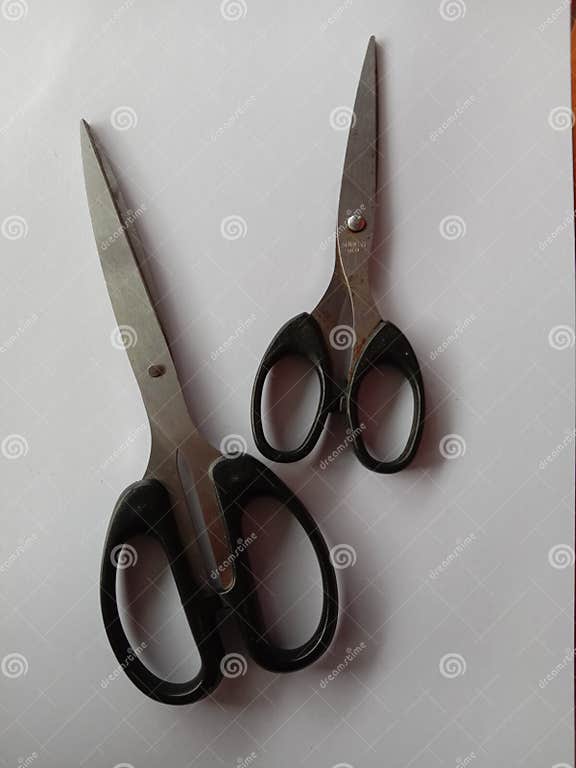 Two Scissors with Different Size Stock Photo - Image of size, wood ...