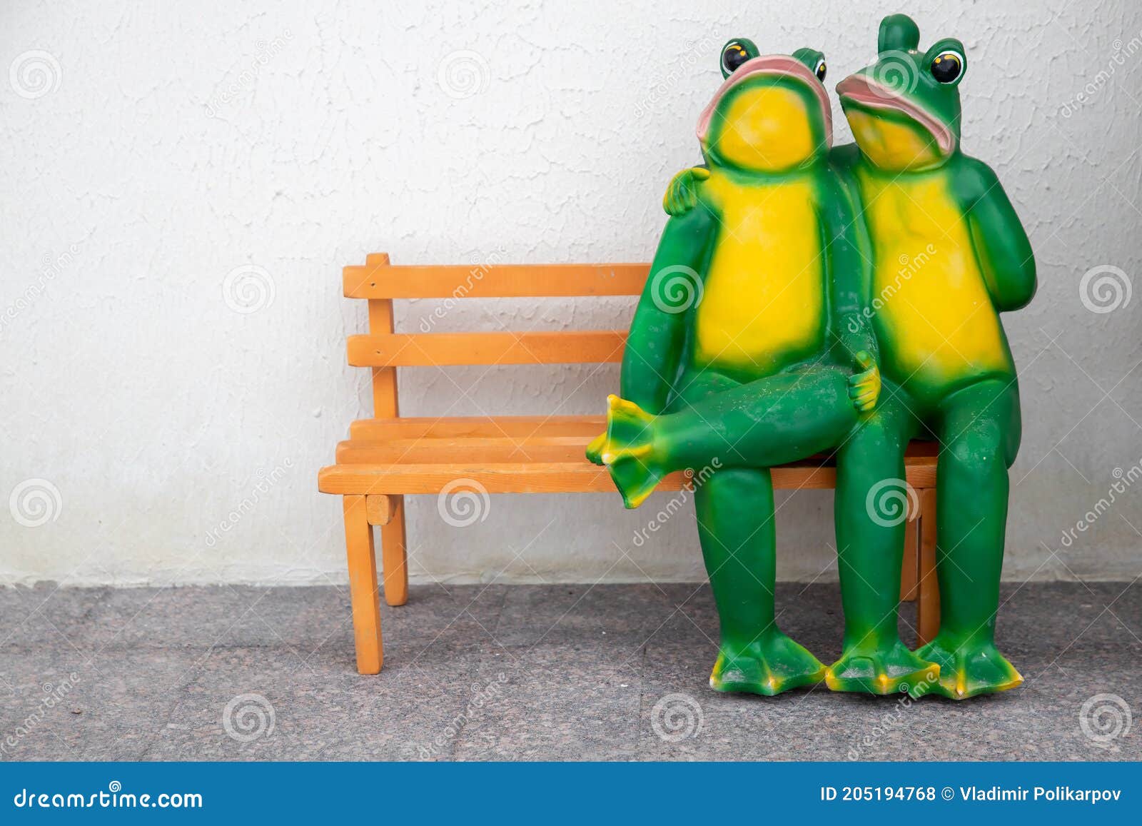 Two Sculptures of Frogs Sit on a Bench and Cuddle Stock Photo - Image ...