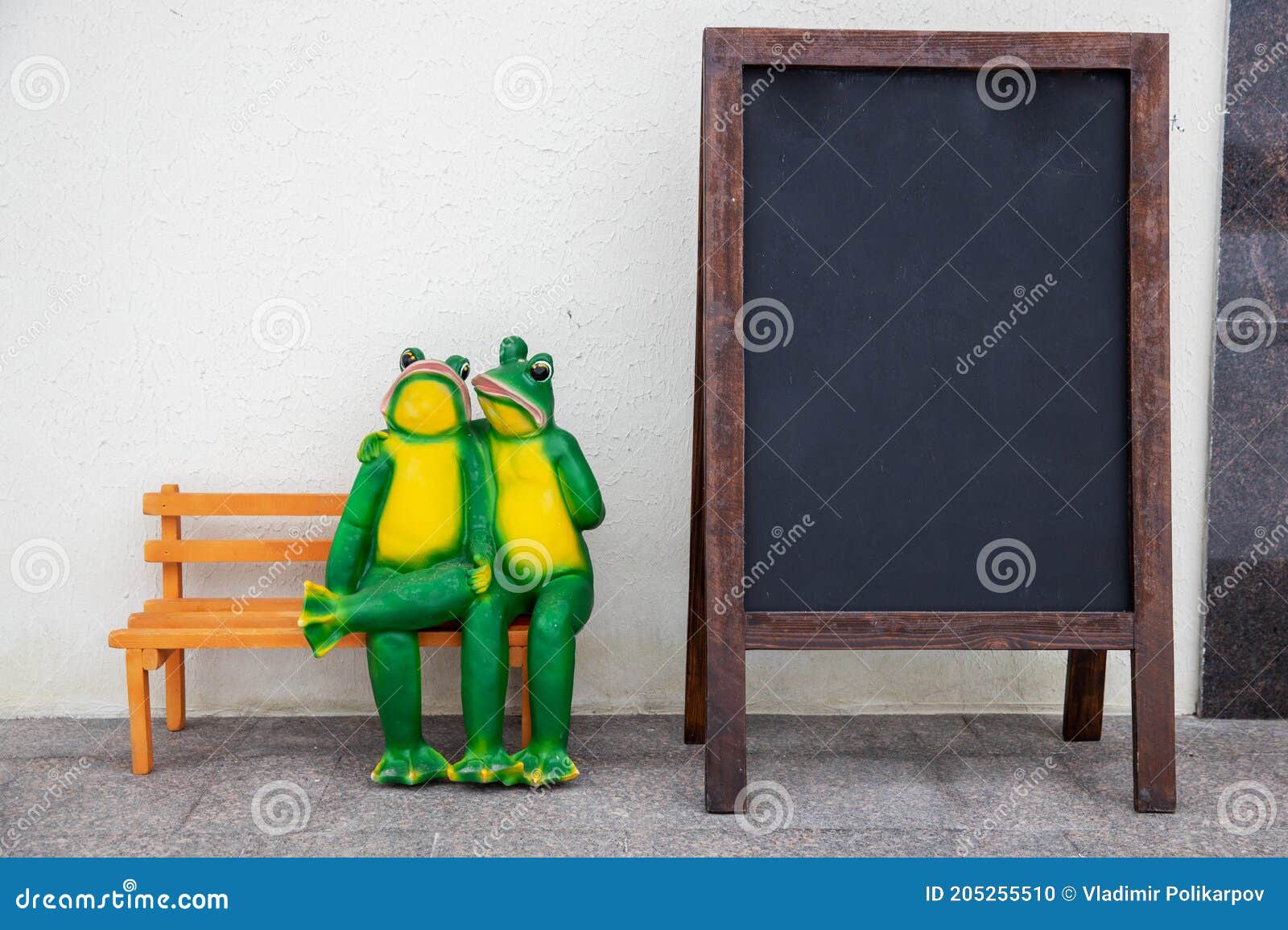 Two Sculptures of Frogs Sit on a Bench and Cuddle Stock Photo - Image ...