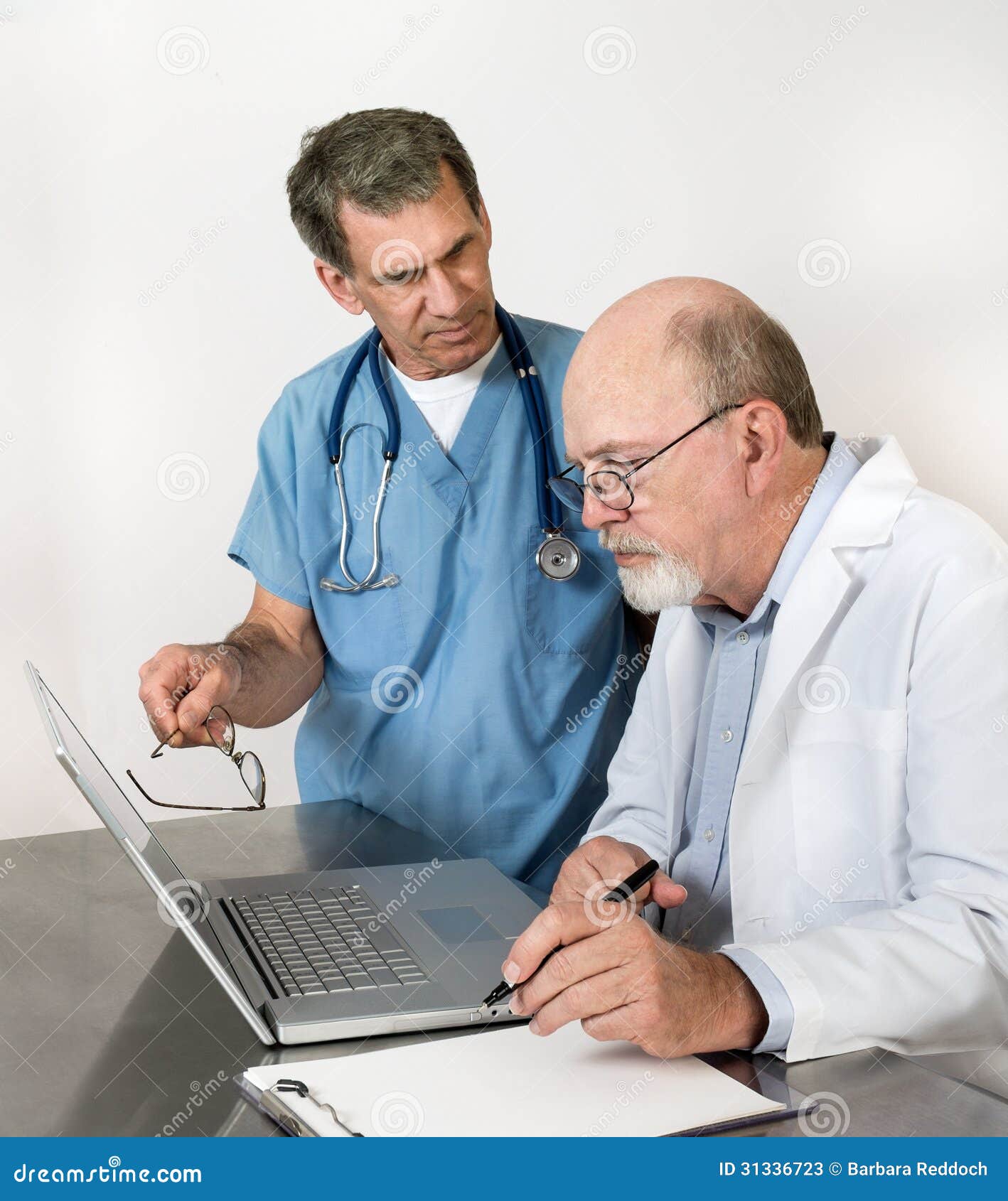 Two Senior Doctors at Laptop Computer Stock Image - Image of insurance ...