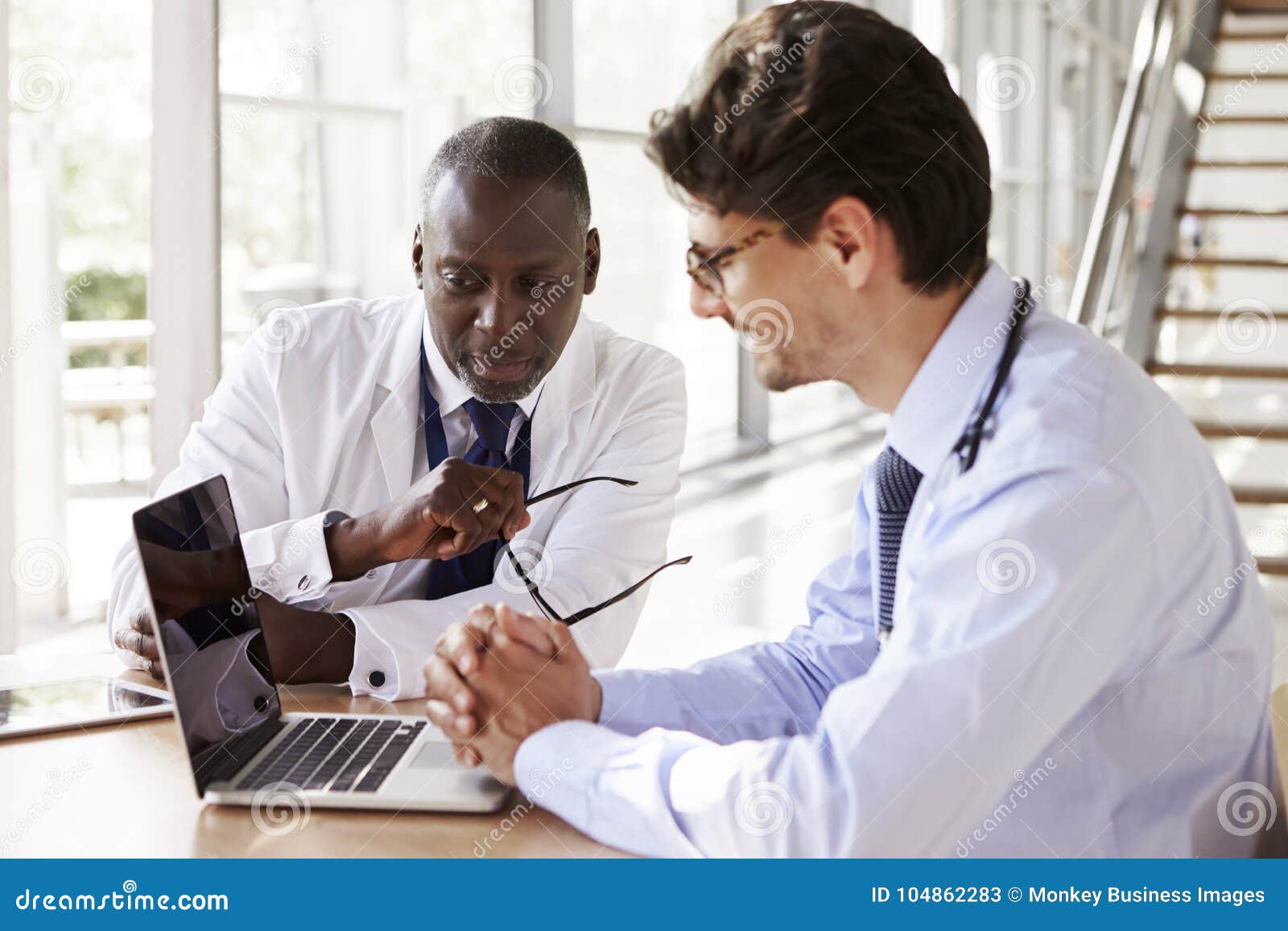 Two Senior Healthcare Workers in Consultation Using Laptop Stock Image ...