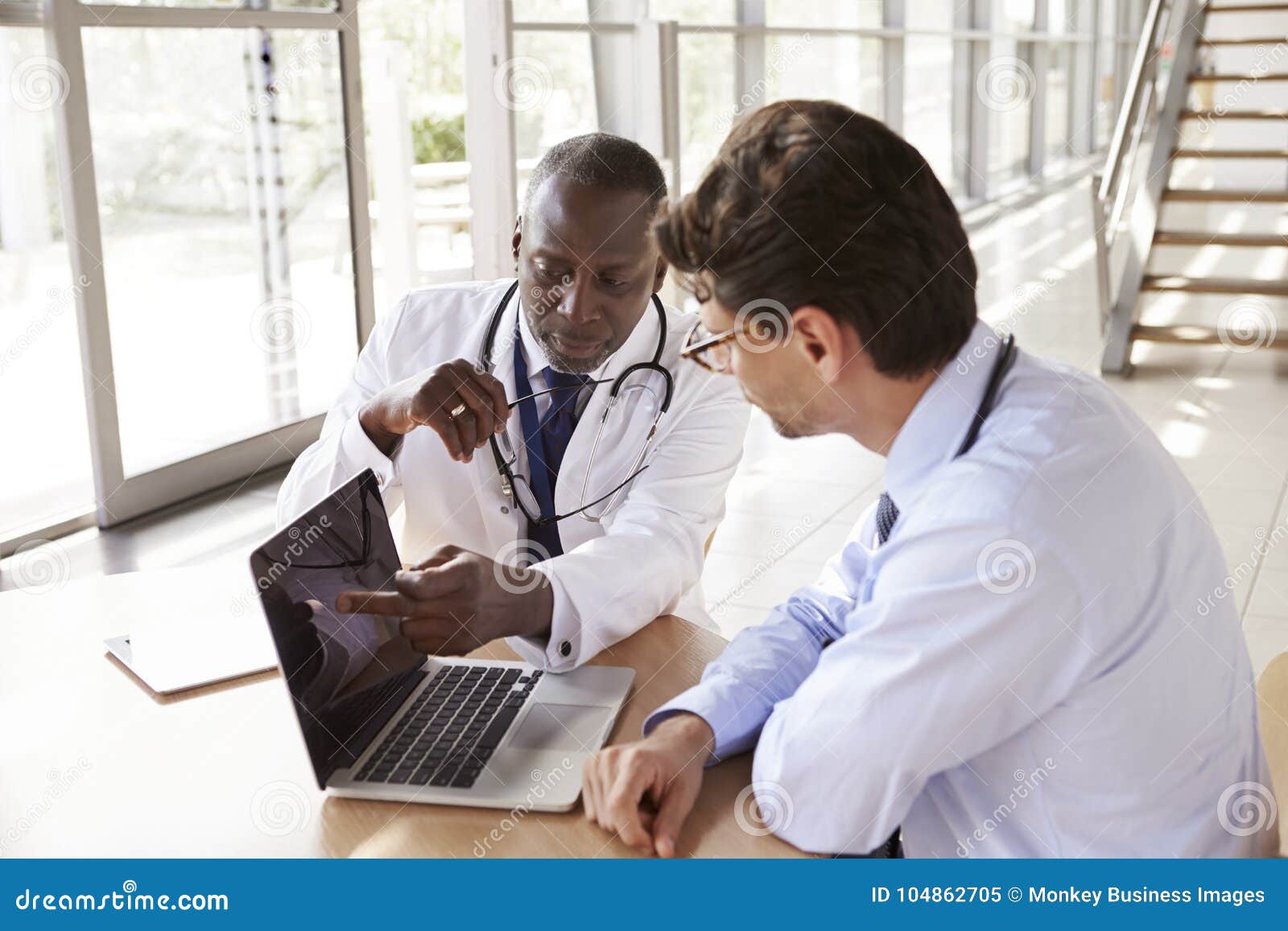 Two Senior Healthcare Workers in Consultation Using Laptop Stock Image ...
