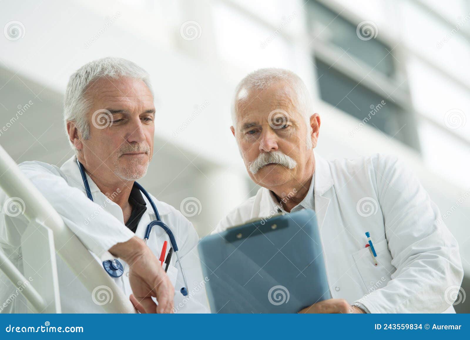 Two Senior Male Doctors Conferring Stock Photo - Image of male, workers ...