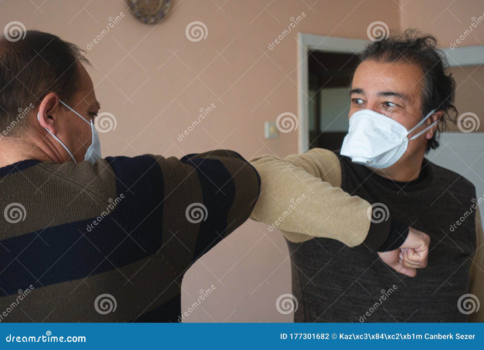 Two Senior Men with Masks Elbow Bumping Stock Photo - Image of ...