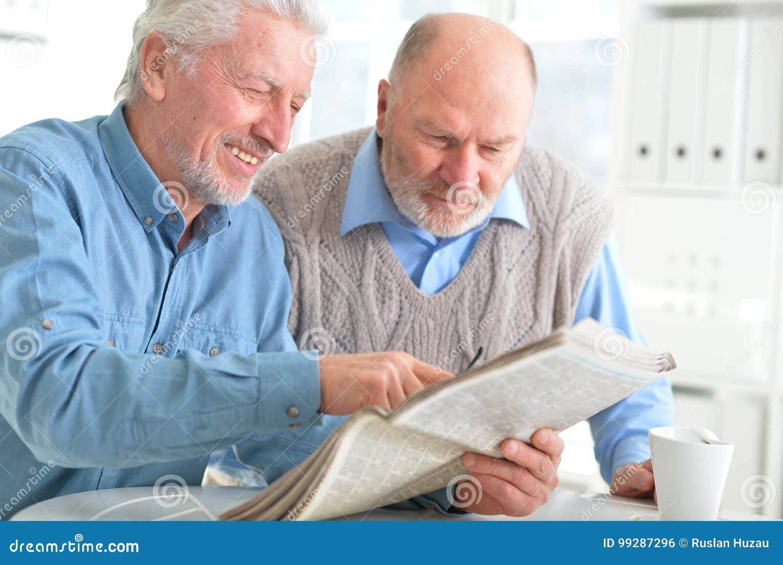 Two Senior Men Sitting at Table and Reading Stock Photo - Image of ... Two Senior Men Sitting at Table and Reading Stock Photo - Image of ...