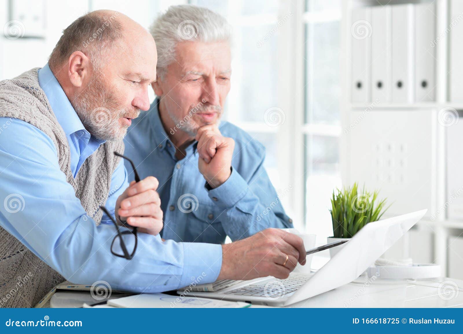 Two Senior Men Sitting at Table and Using Laptop Stock Image - Image of ...