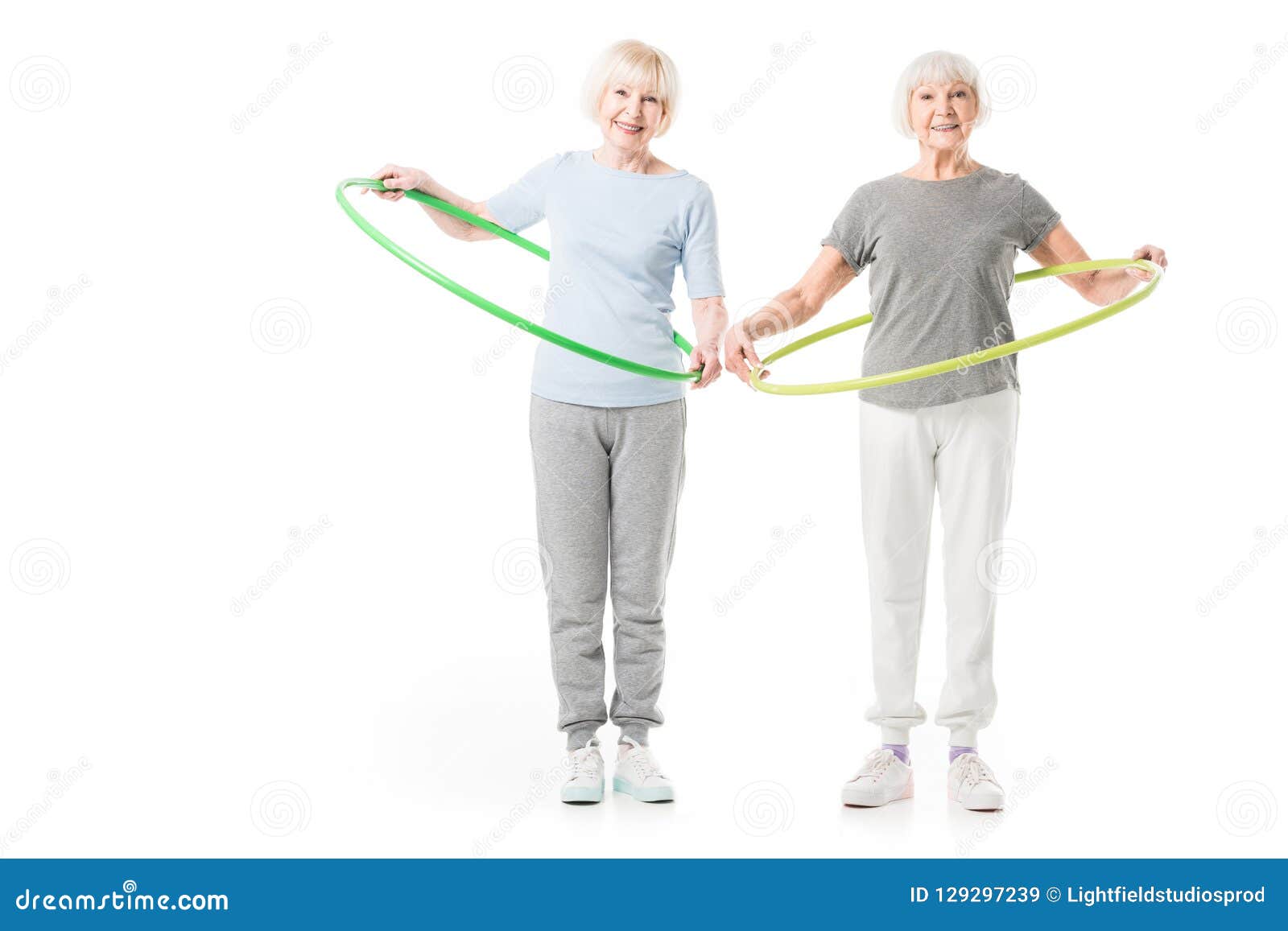 Two Senior Sportswomen Doing Hula Hoop Excercise Stock Image - Image of ...