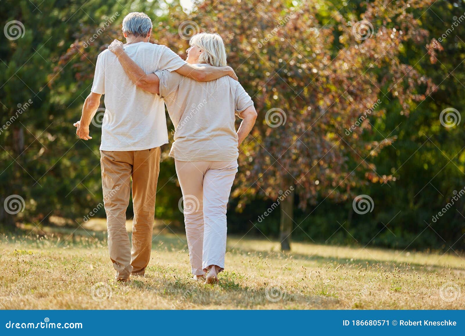 Two Seniors Go for a Walk in Summer Stock Image - Image of embrace ...