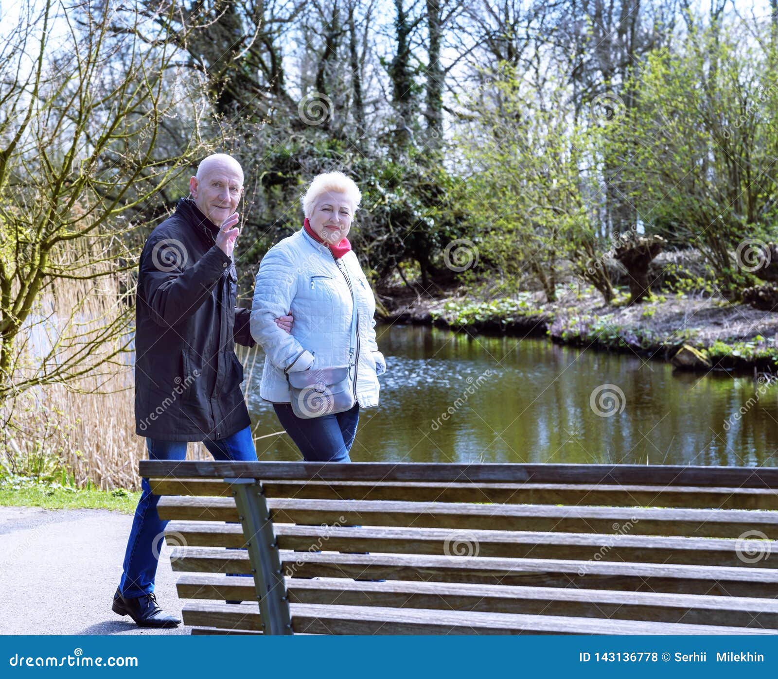 Two Seniors Seniors Walking in Spring Park Stock Photo - Image of ...