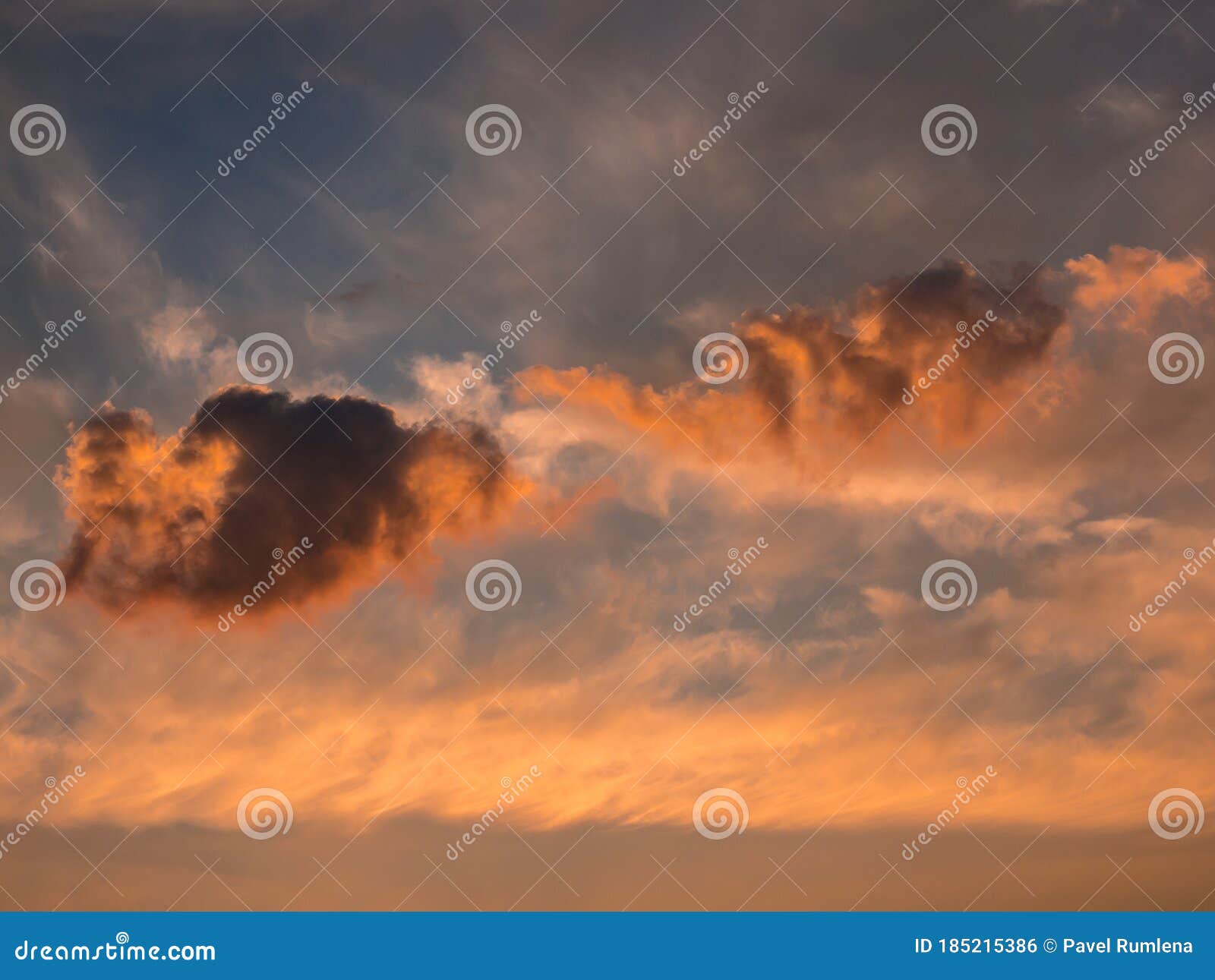 Two Separated Clouds Early in the Morning at the Time of the Golden ...