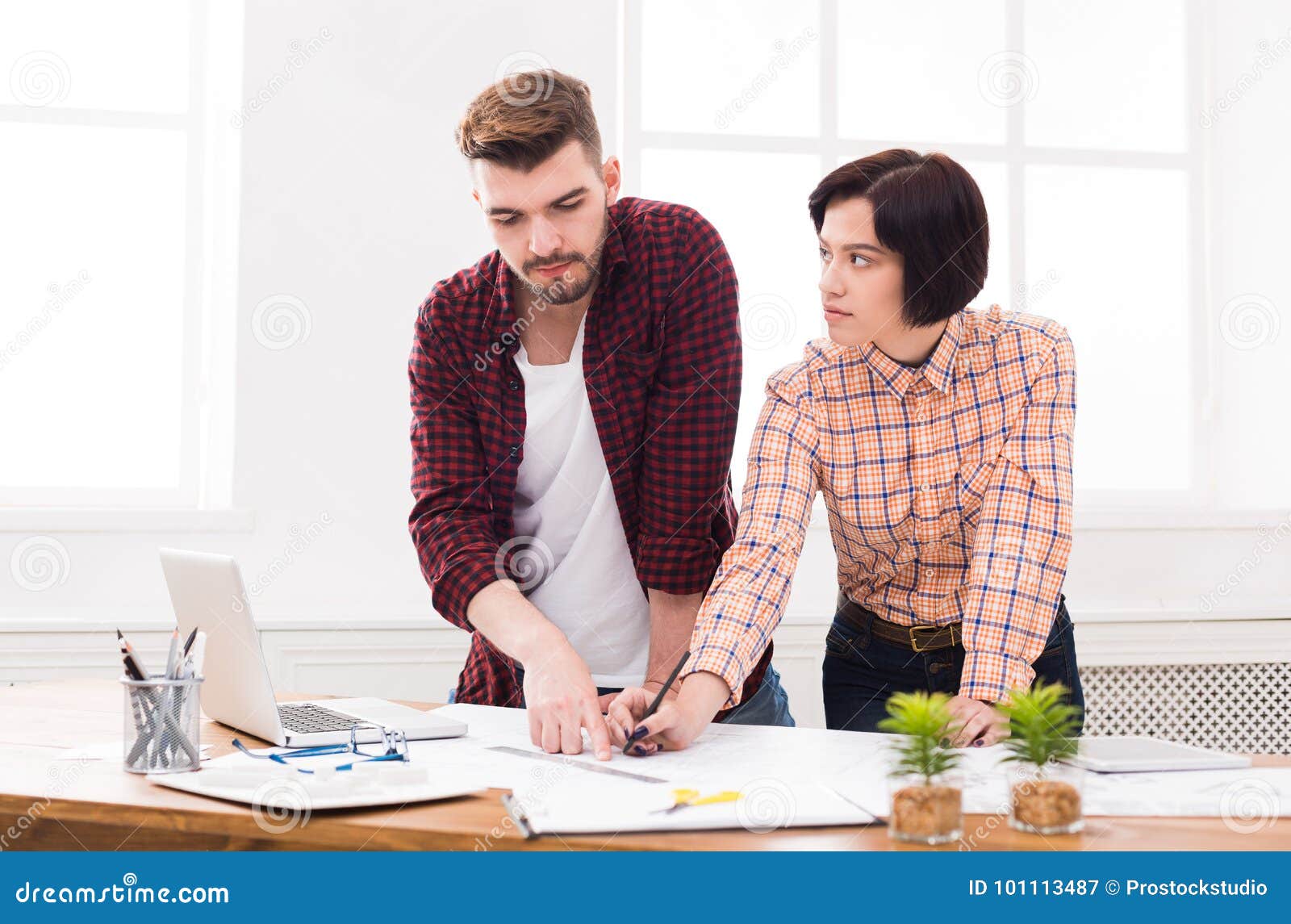 Two Serious Architects Discussing Building Plan Stock Image - Image of ...