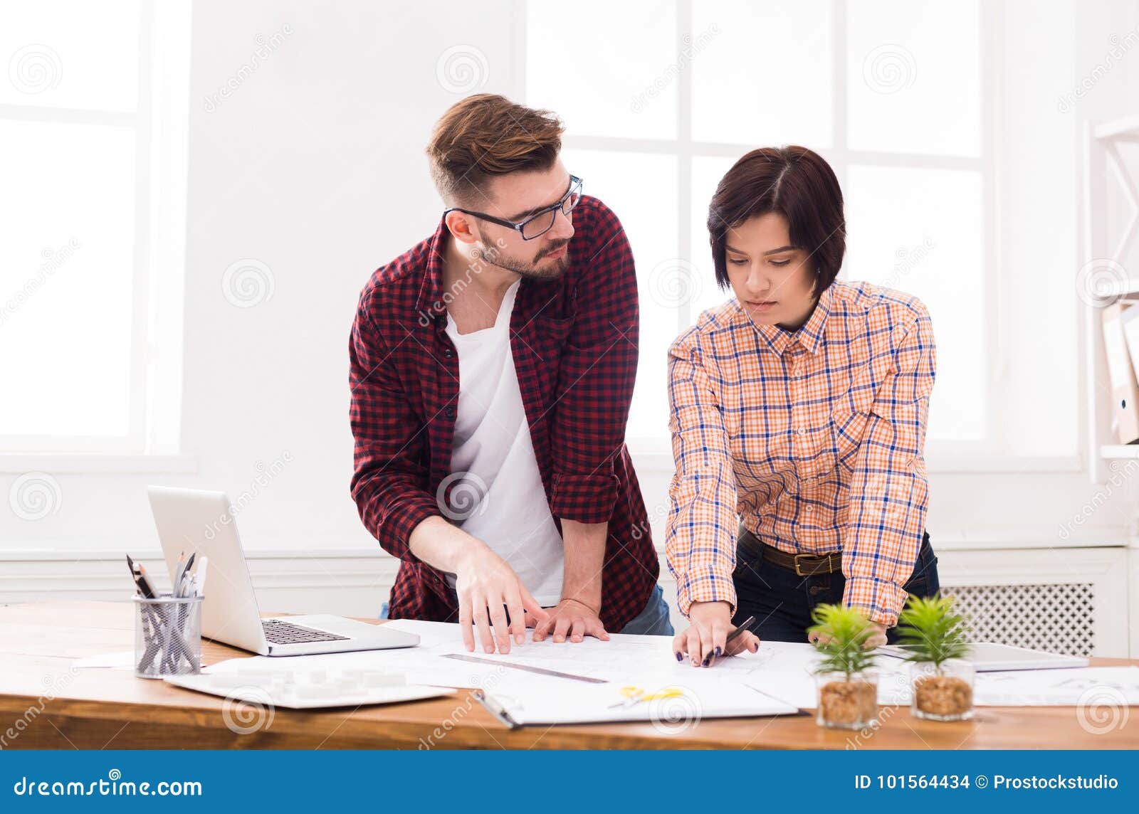 Two Serious Architects Discussing Building Plan Stock Photo - Image of ...