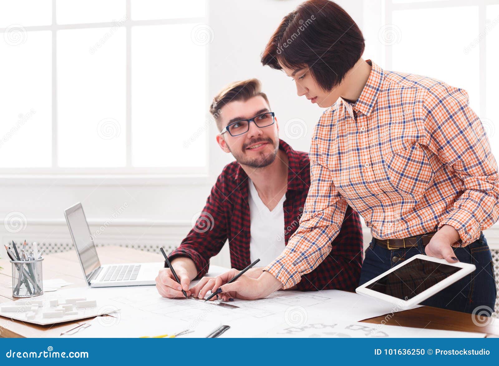 Two Serious Architects Discussing Building Plan Stock Photo - Image of ...