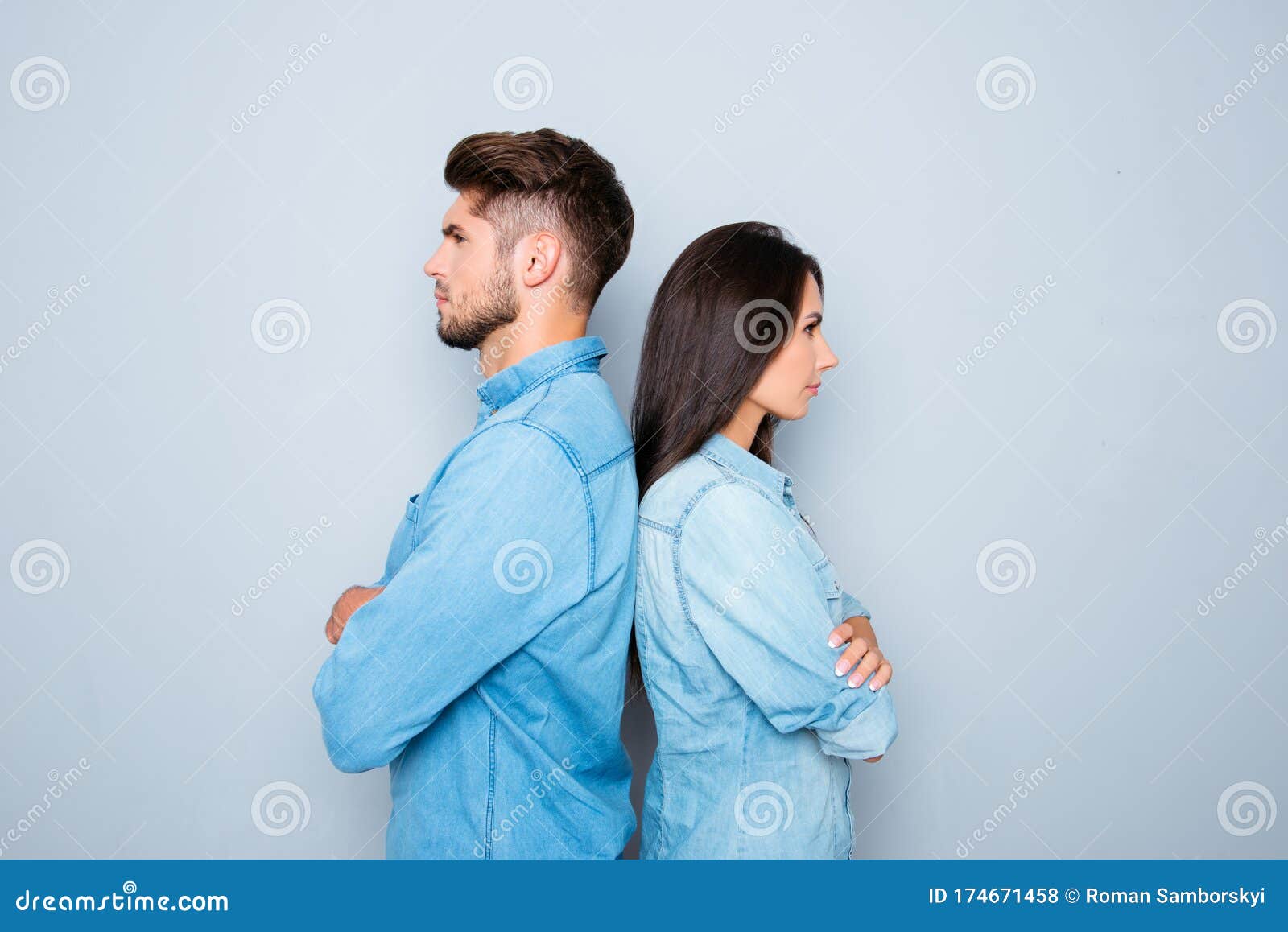 Two Serious Business Coleagues Standing Back To Back Stock Photo ...