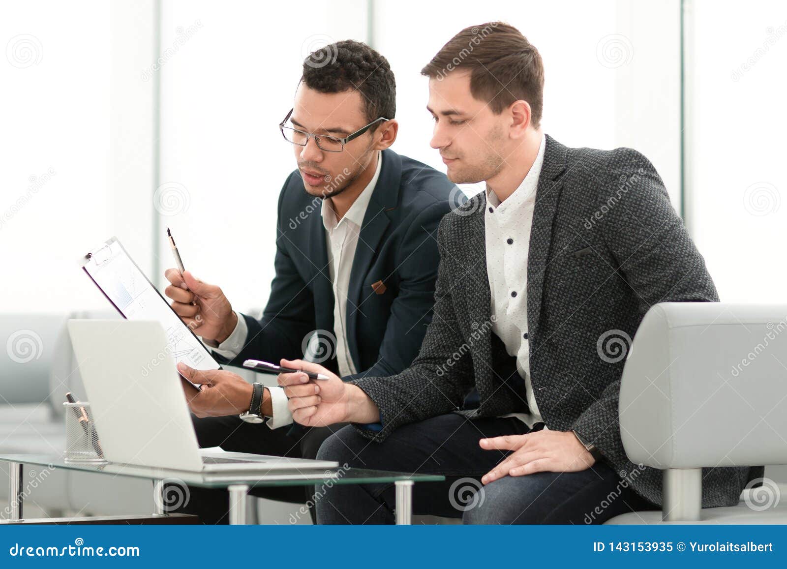 Two Serious Business People Discuss Business Documents. Stock Image ...