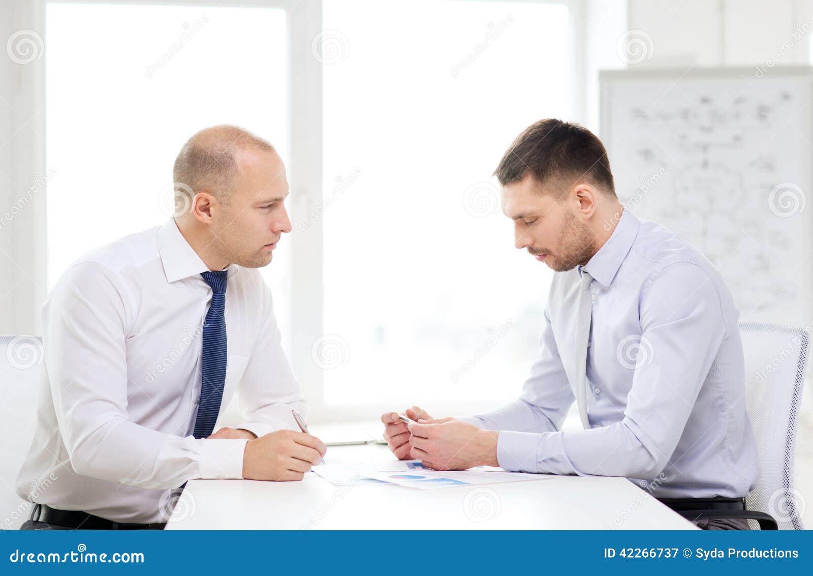 Two Serious Businessman with Papers in Office Stock Image - Image of ...