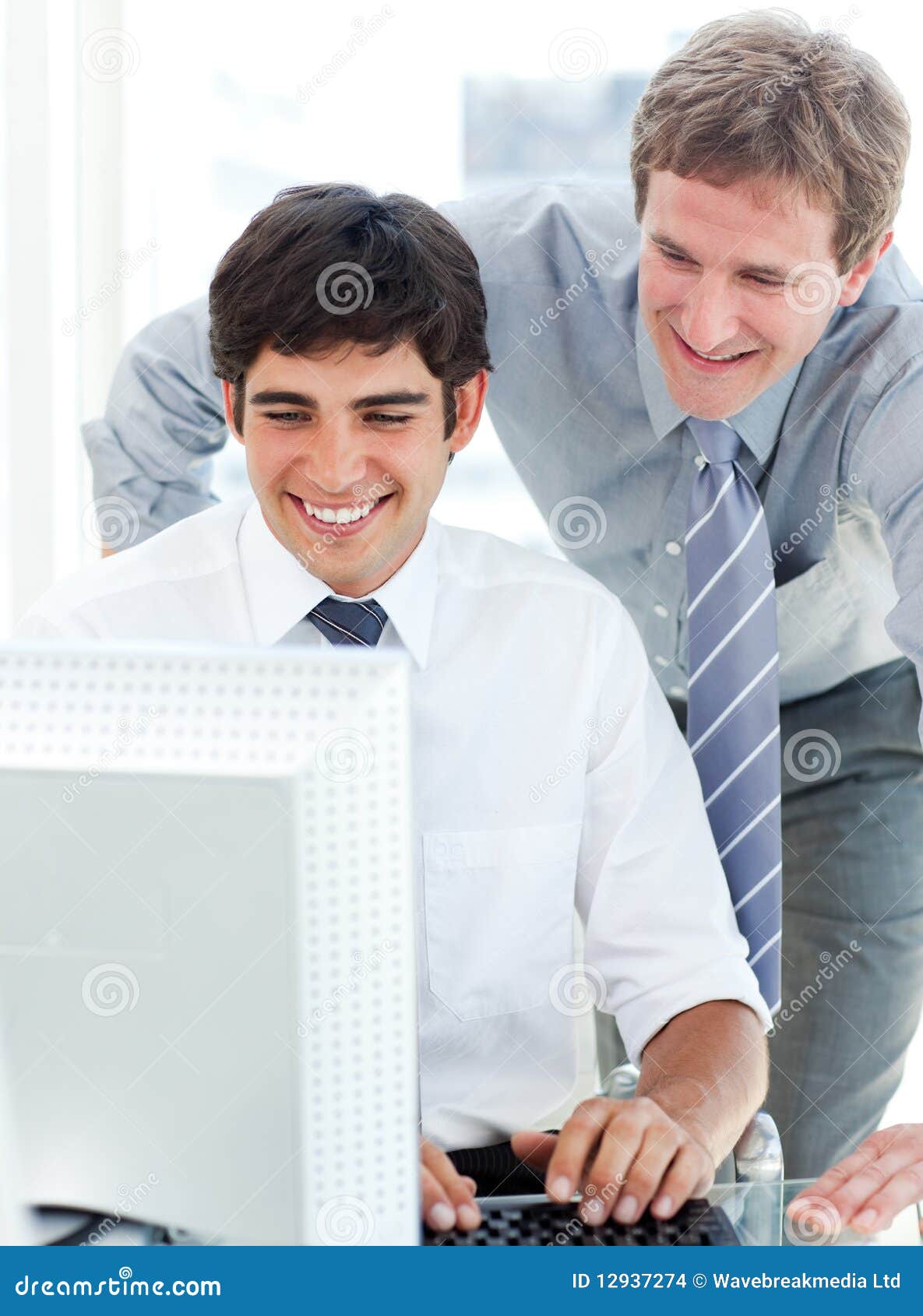 Two Serious Businessmen Working at a Computer Stock Photo - Image of ...