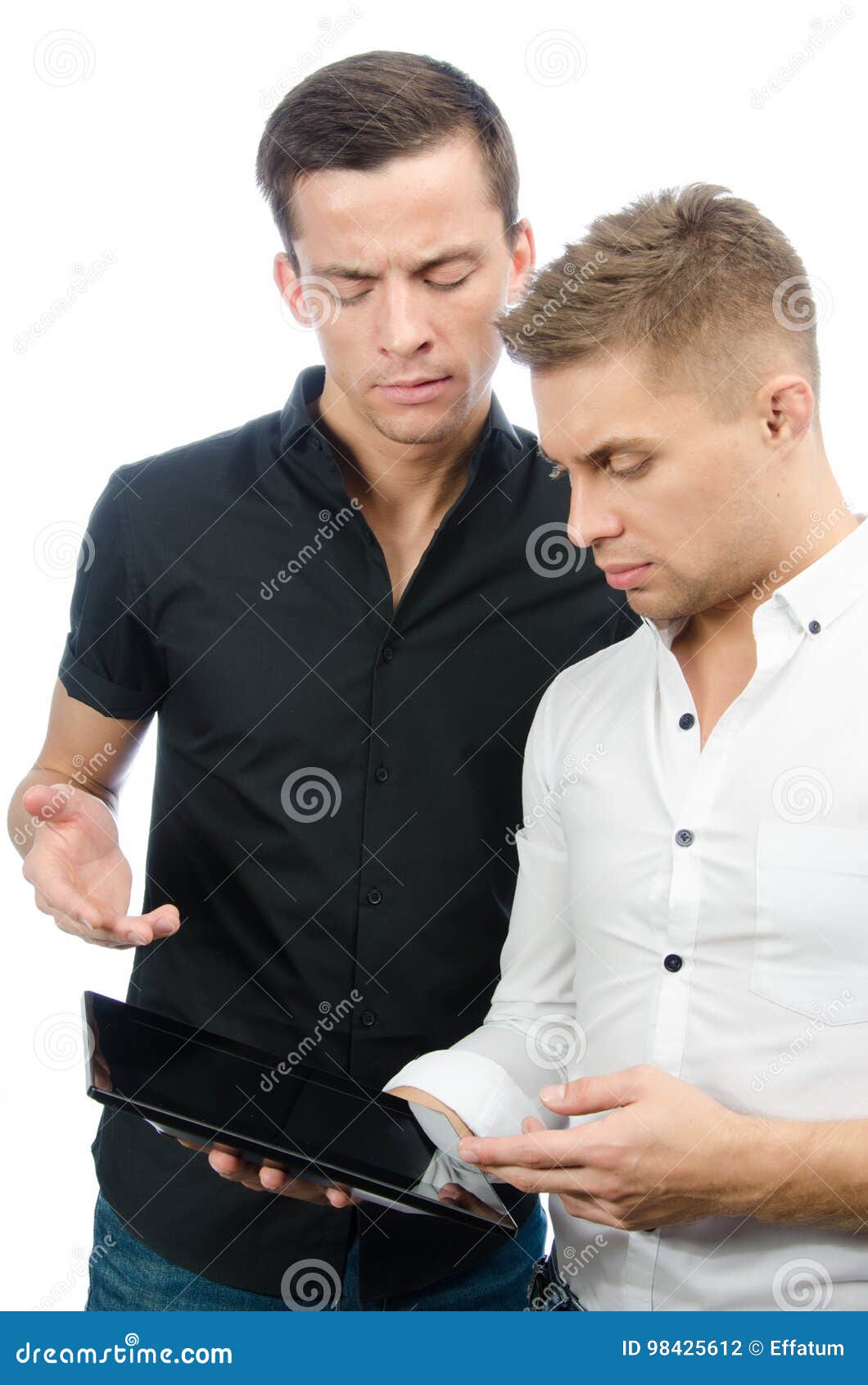 Two Serious Guys are Working on the Project. Tablet and Technology ...