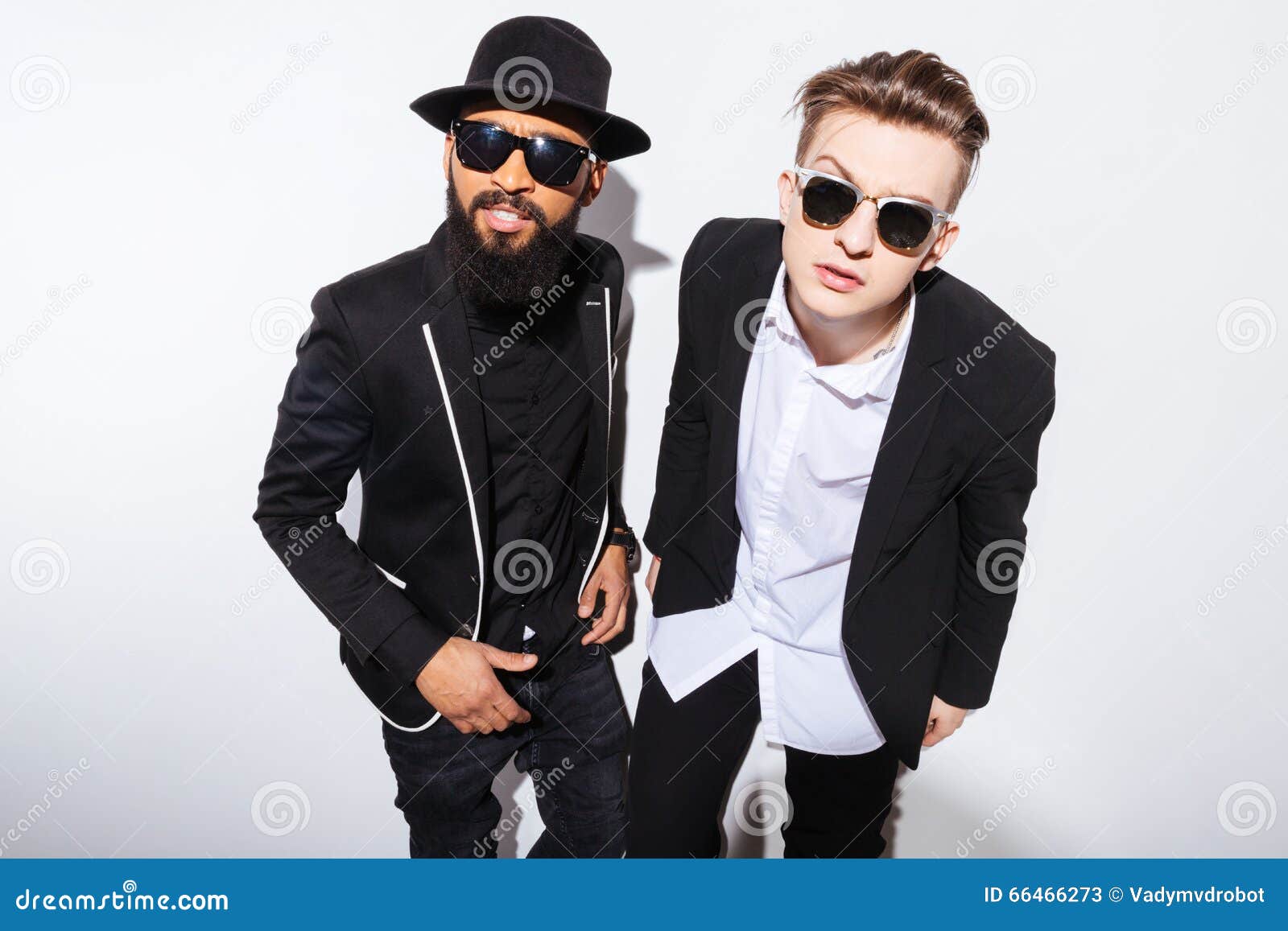 Two Serious Young Men Standing and Staring on You Stock Image - Image ...