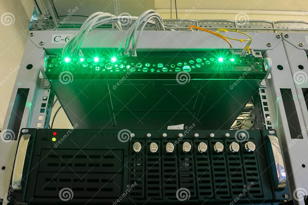 Two Servers are Installed in a Rack in the Server Room. the Green ...