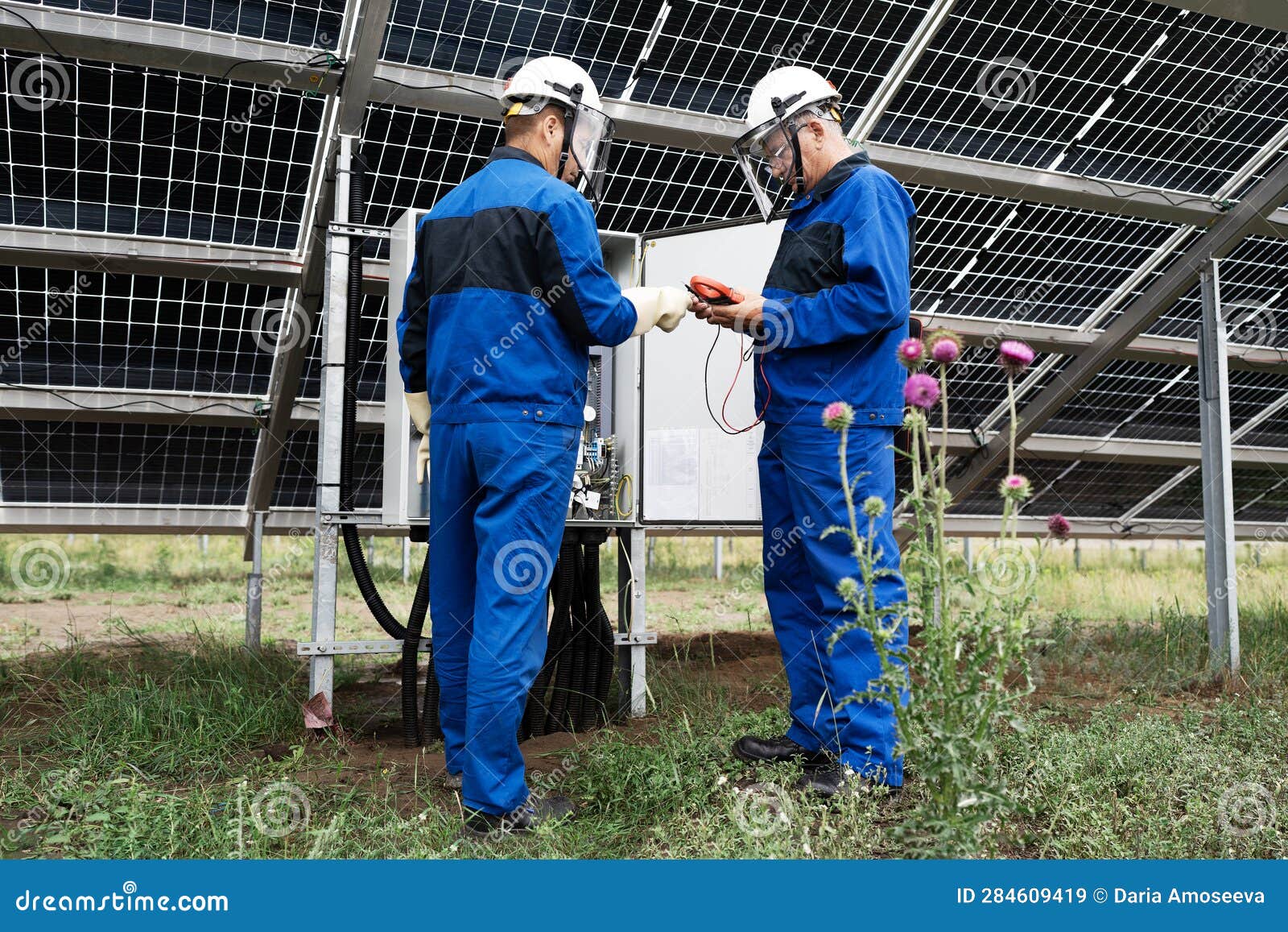 Two Service Engineers or Electrician Working on Checking Transformer ...
