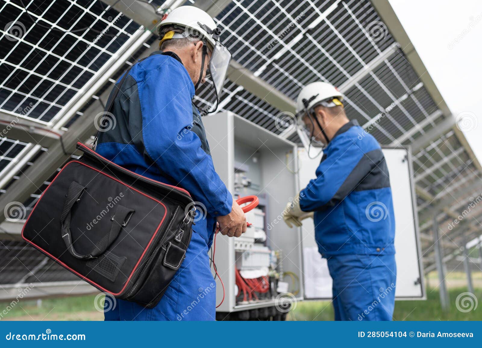 Two Service Engineers or Electrician Working on Checking Transformer ...