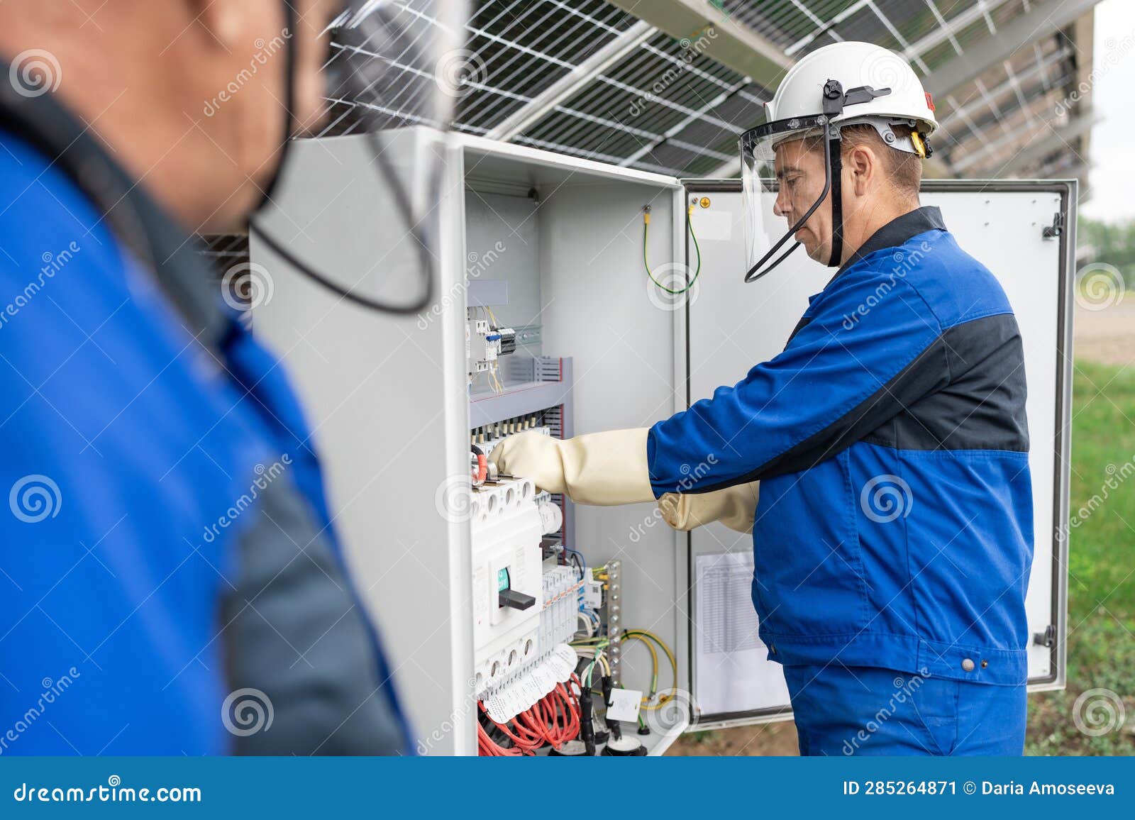 Two Service Engineers or Electrician Working on Checking Transformer ...
