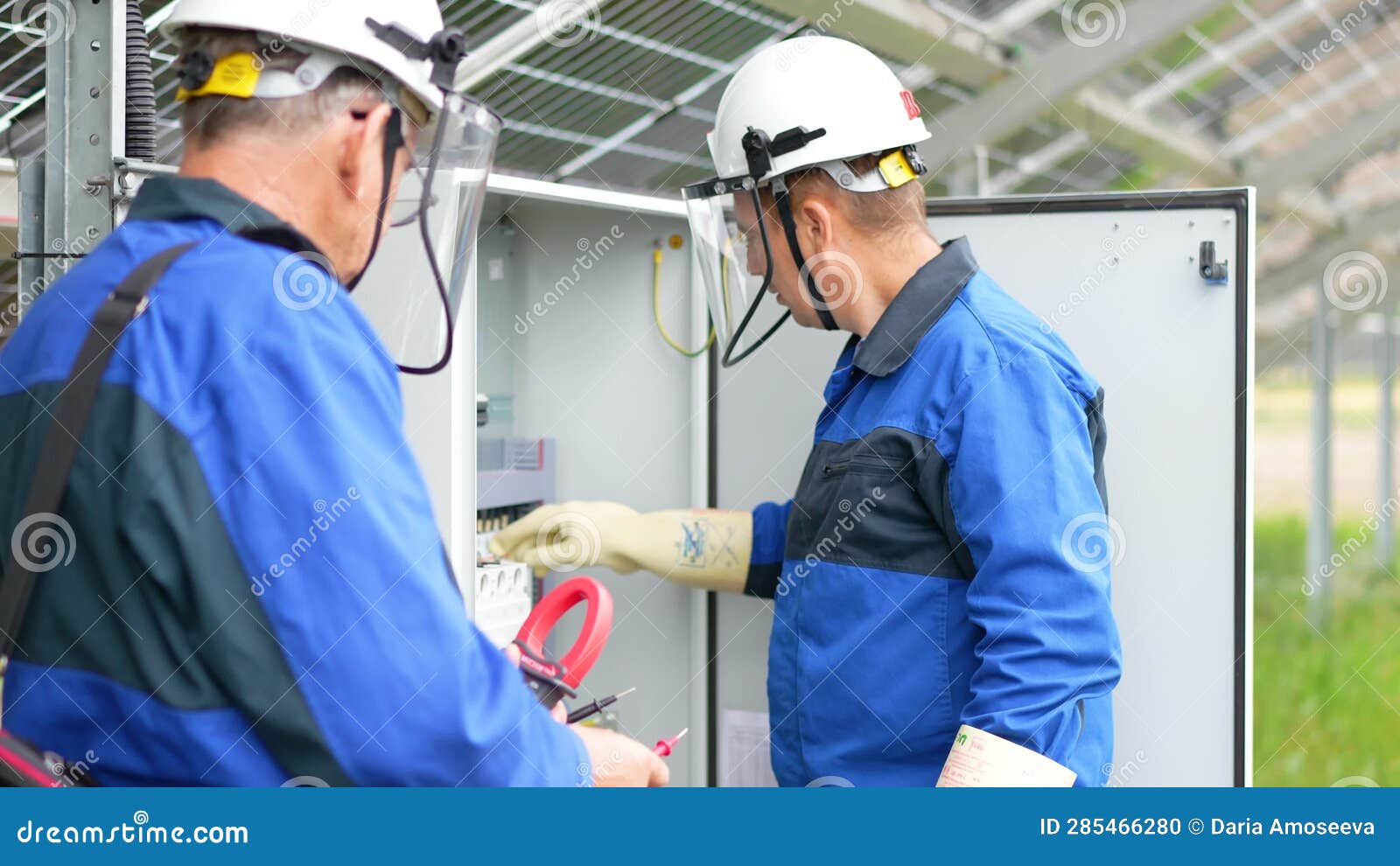 Two Service Engineers or Electrician Working on Checking Transformer ...