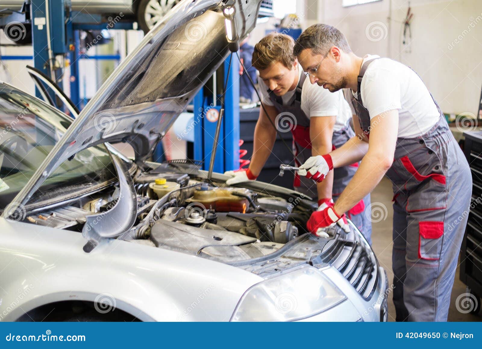 Two Servicemen in a Car Workshop Stock Photo - Image of repair ...