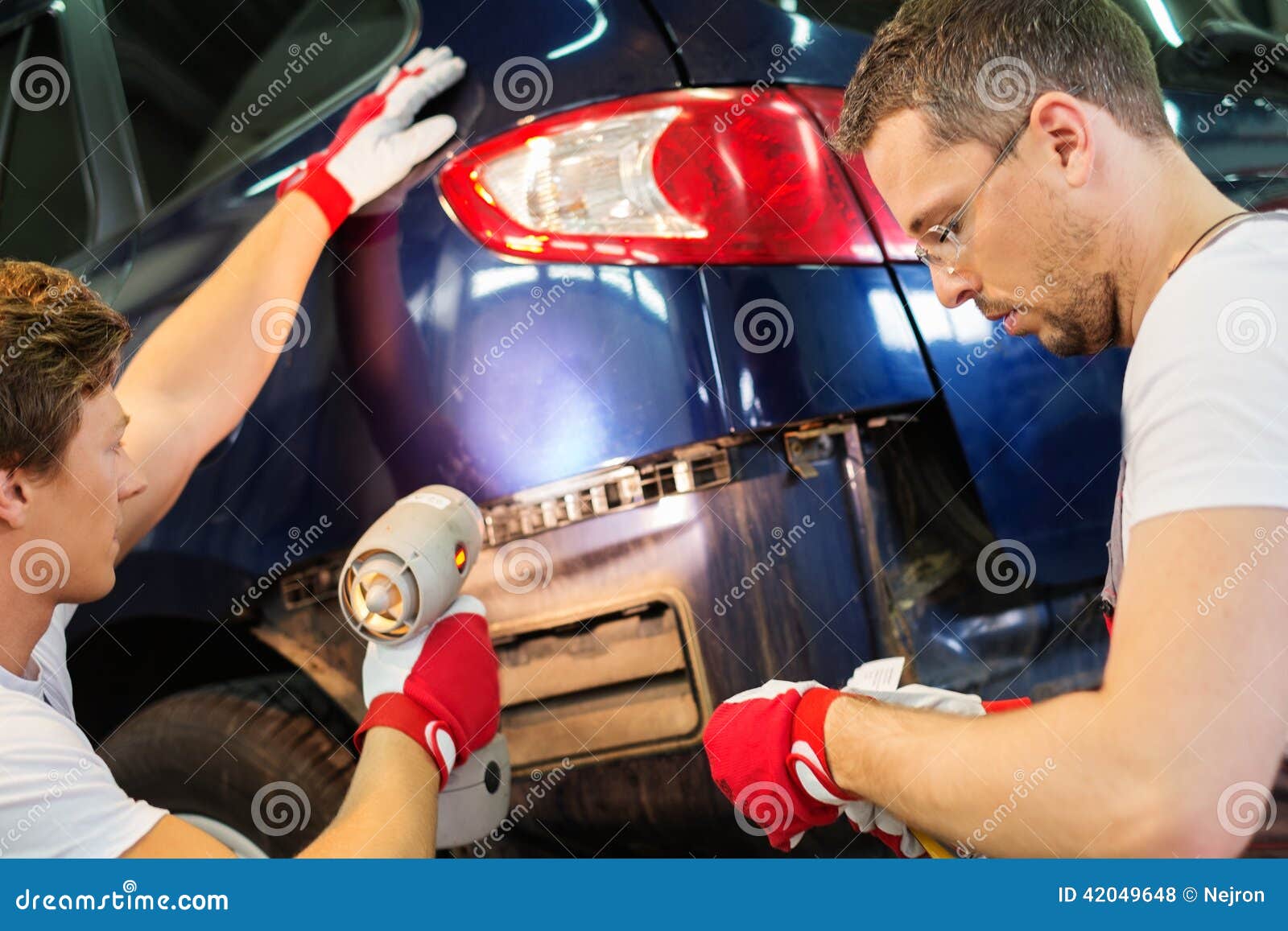 Two Servicemen in a Car Workshop Stock Photo - Image of finish, dealer ...