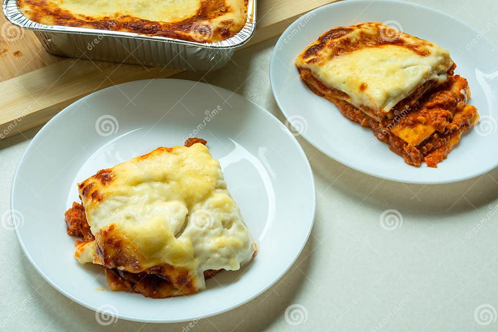 Two Servings of Lasagne on a Plate Stock Image - Image of food, portion ...