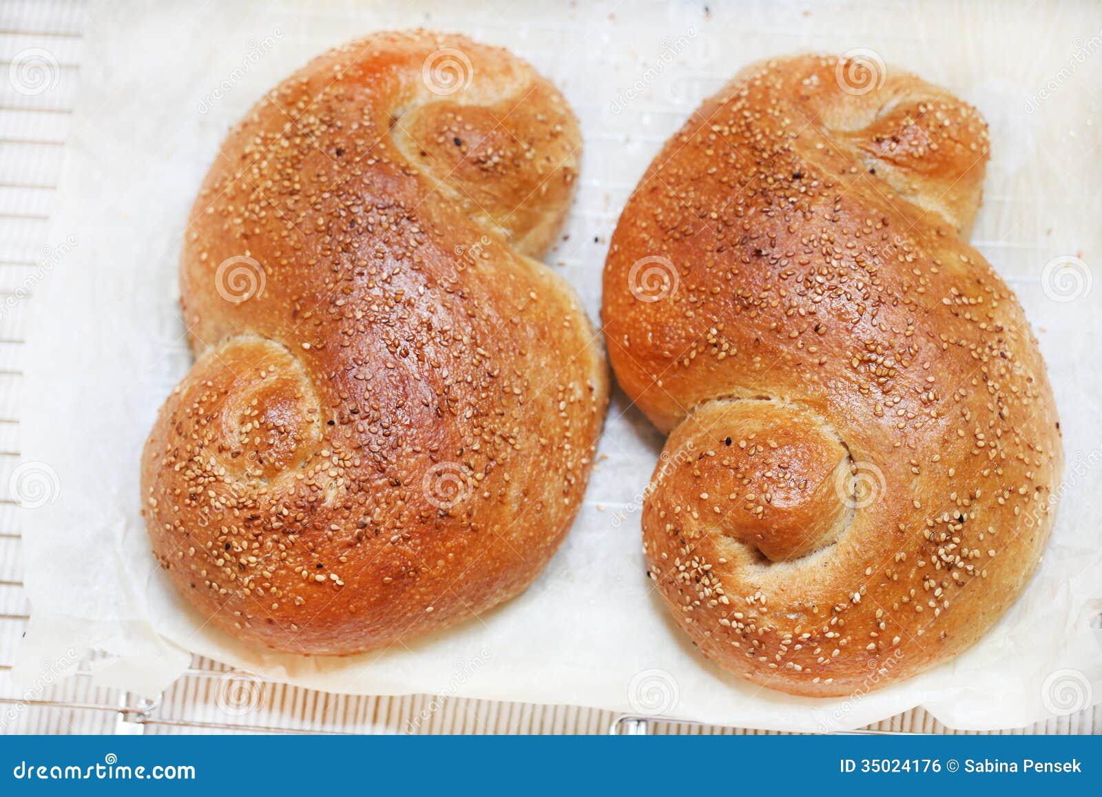 Two Sesame Bread Rolls on Baking Paper, Cooking Stock Photo - Image of ...