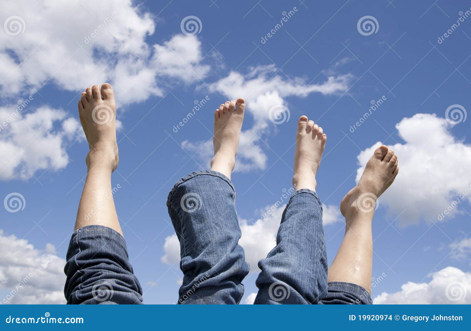 Two Sets of Feet in the Air. Stock Photo - Image of blue, human: 19920974